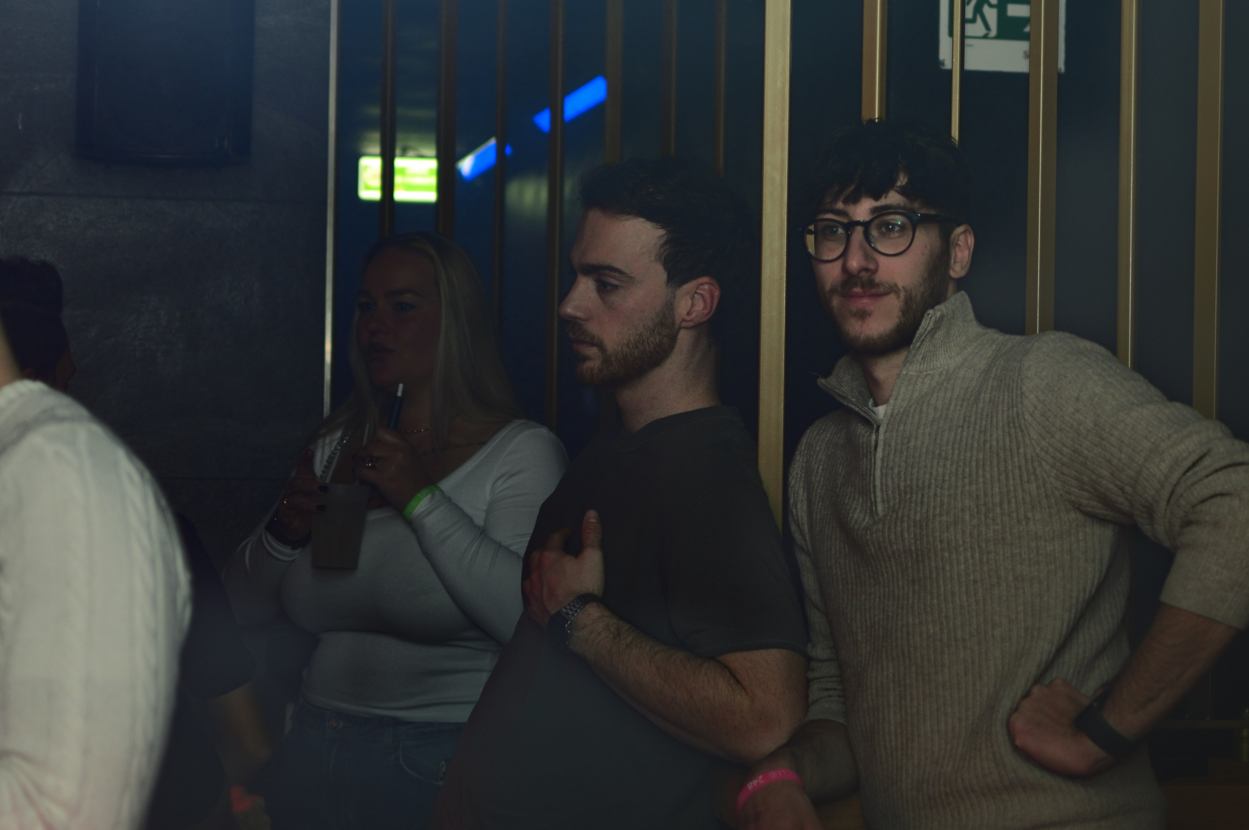 Midnight Moment: Friends Gather in a Dim Club Scene