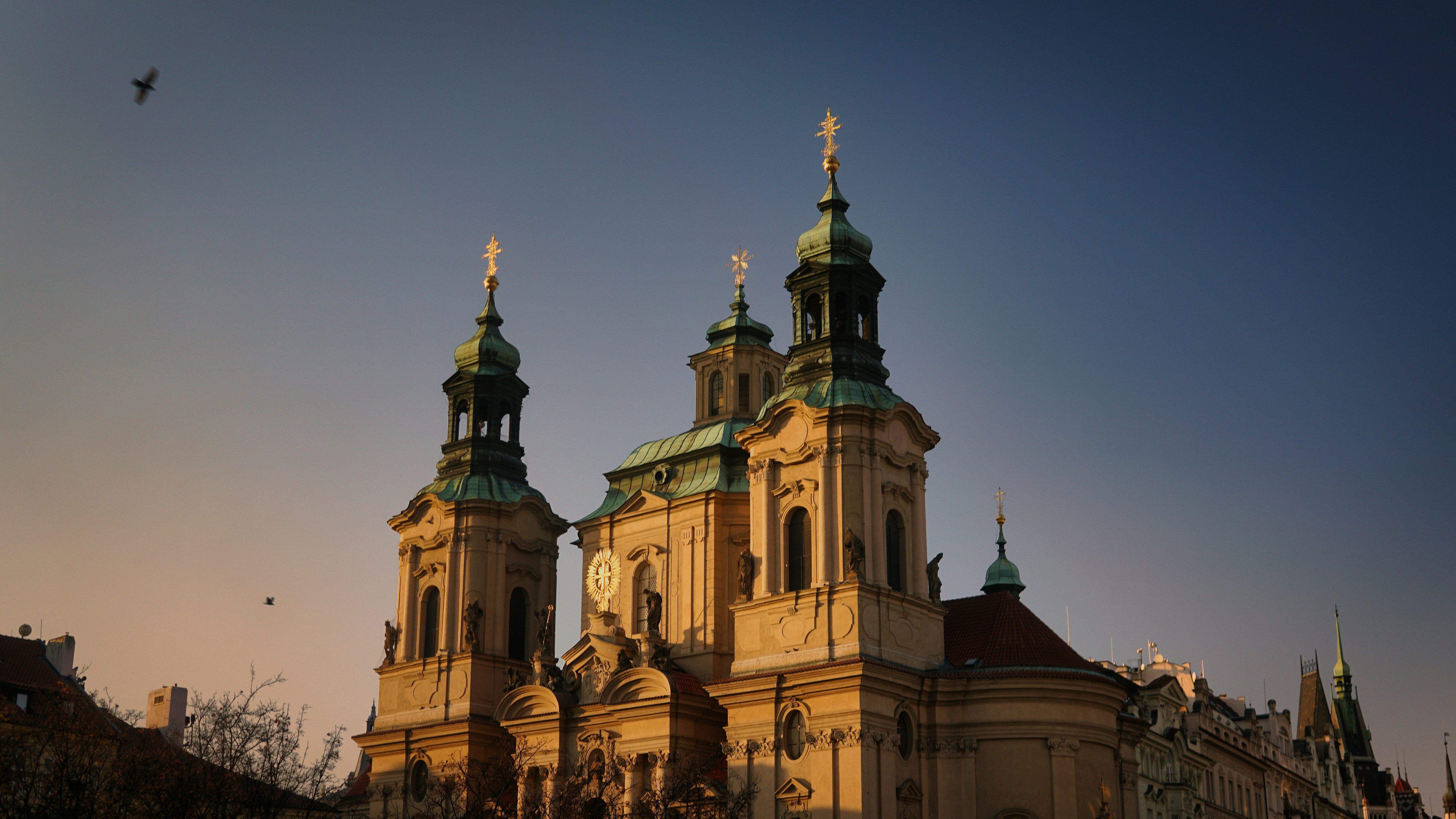 Ornate church with green domes against blue skyDavid Lam