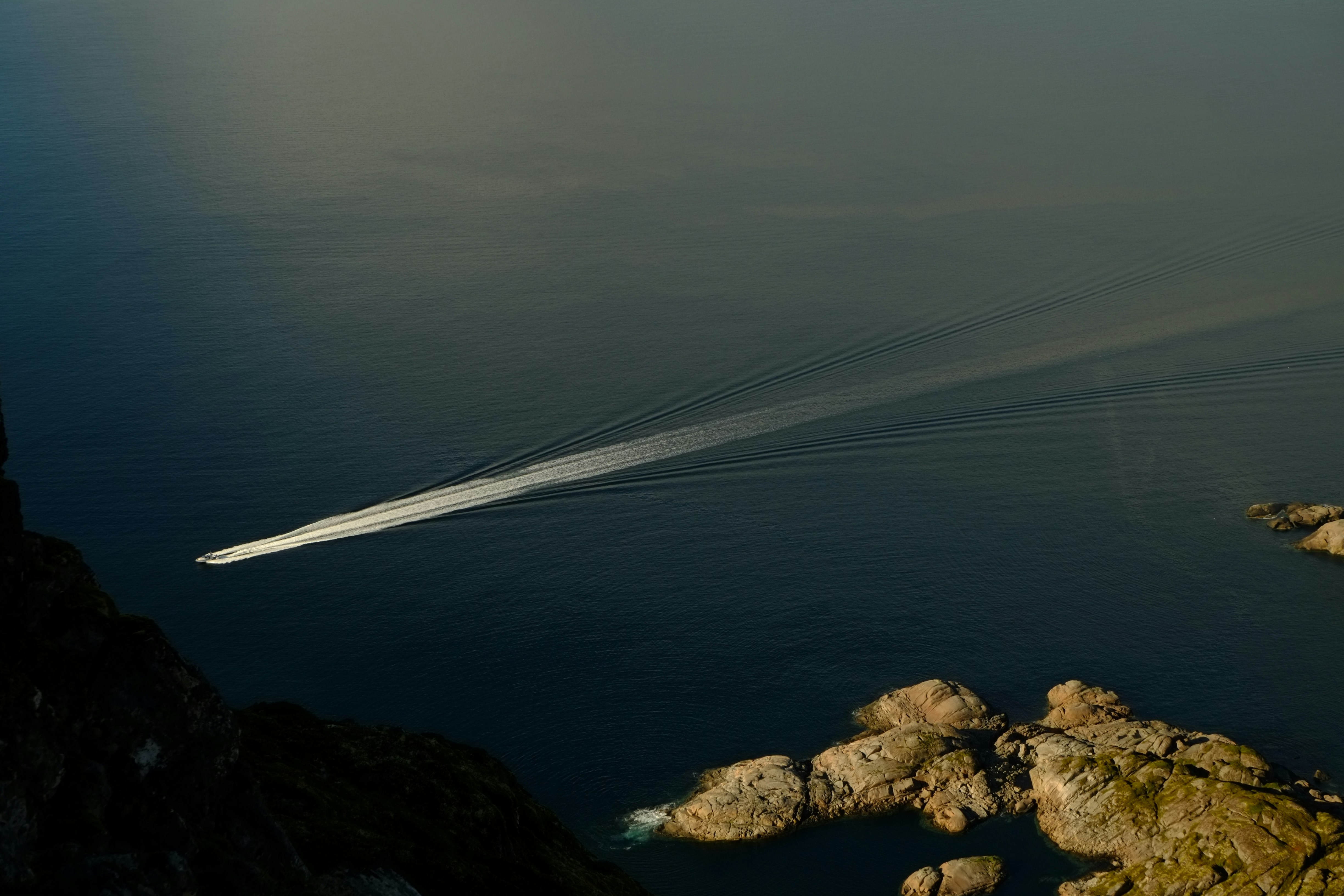 White Wake: A Seaborne Sliver Slicing Toward the Horizon