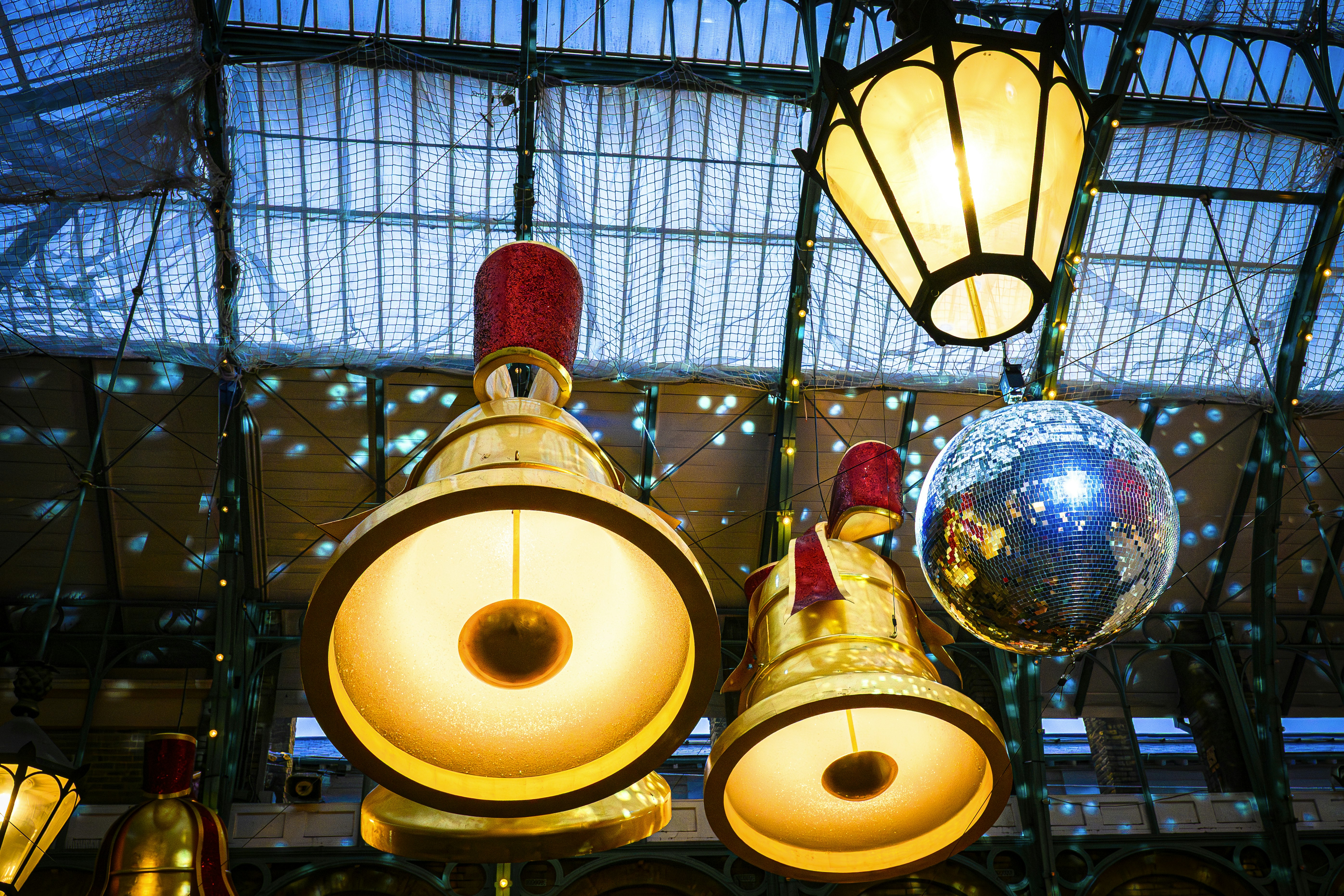 Gilded Orbs and Neon Glass: Festive Lighting Overhead