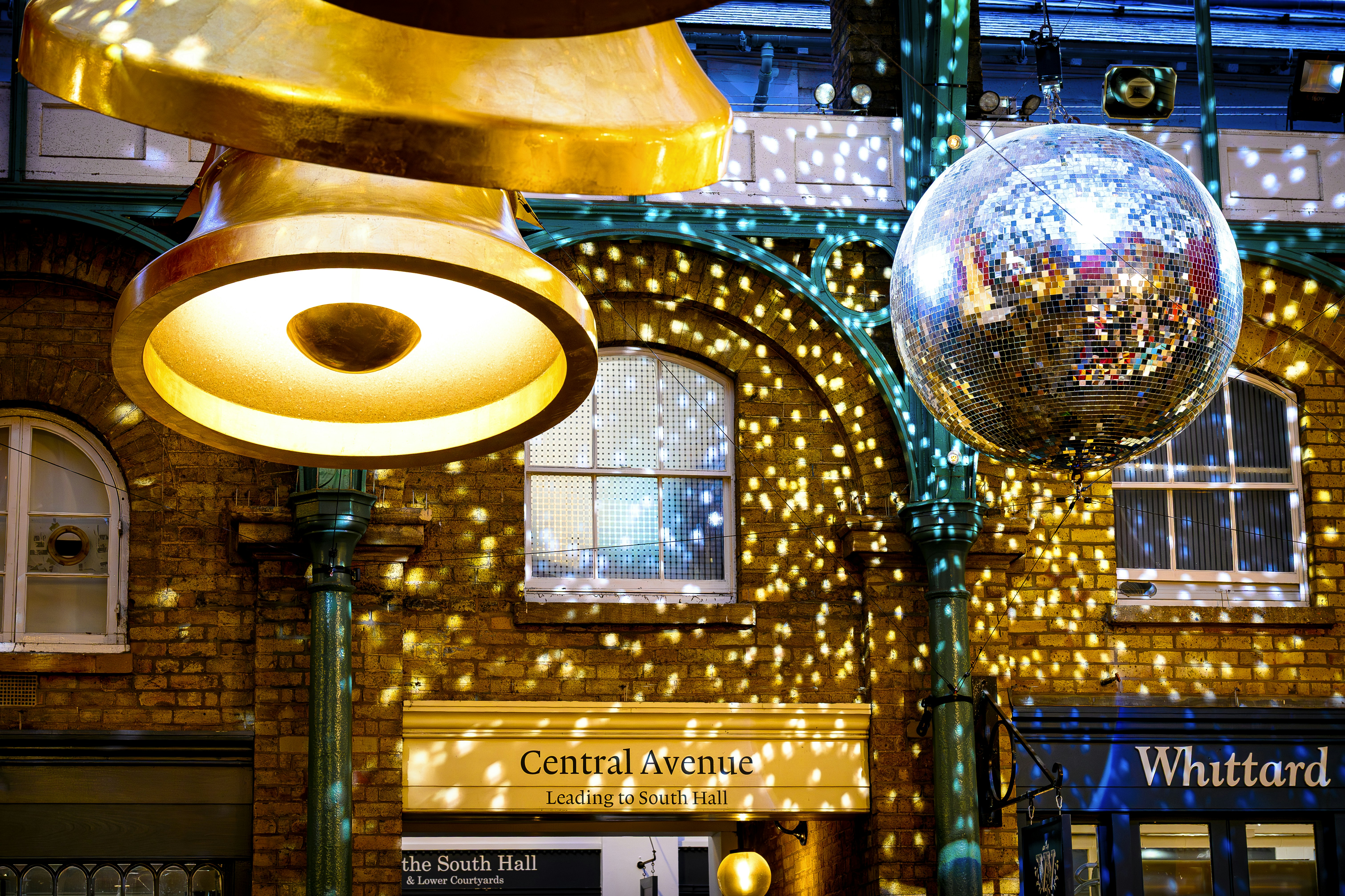 Disco in the Street: a Glimmering Orb and Golden Ring Lights