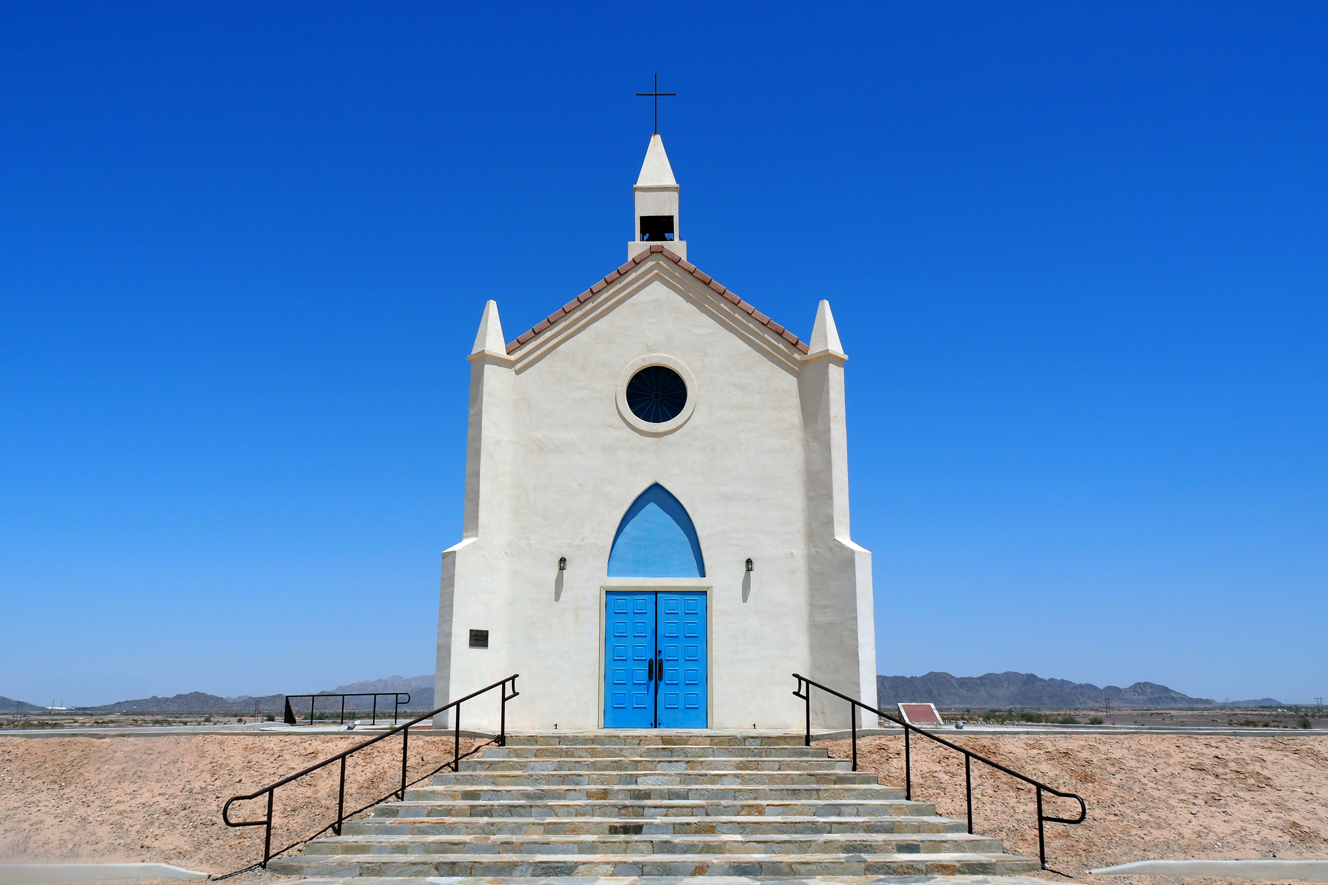Blue Door Chapel at Distant Desert Horizon