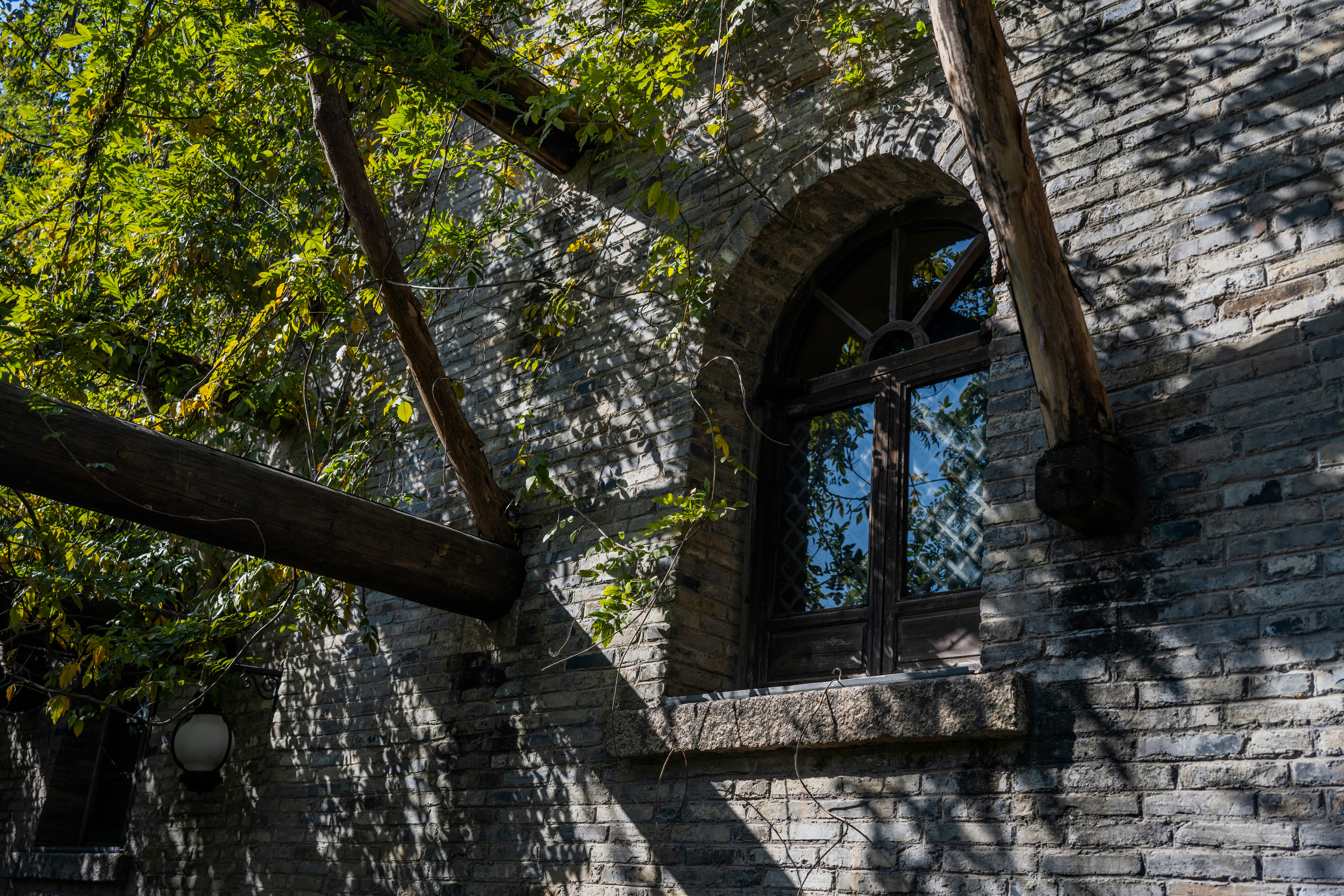 Sunlit Window in a Quiet Stone Wall