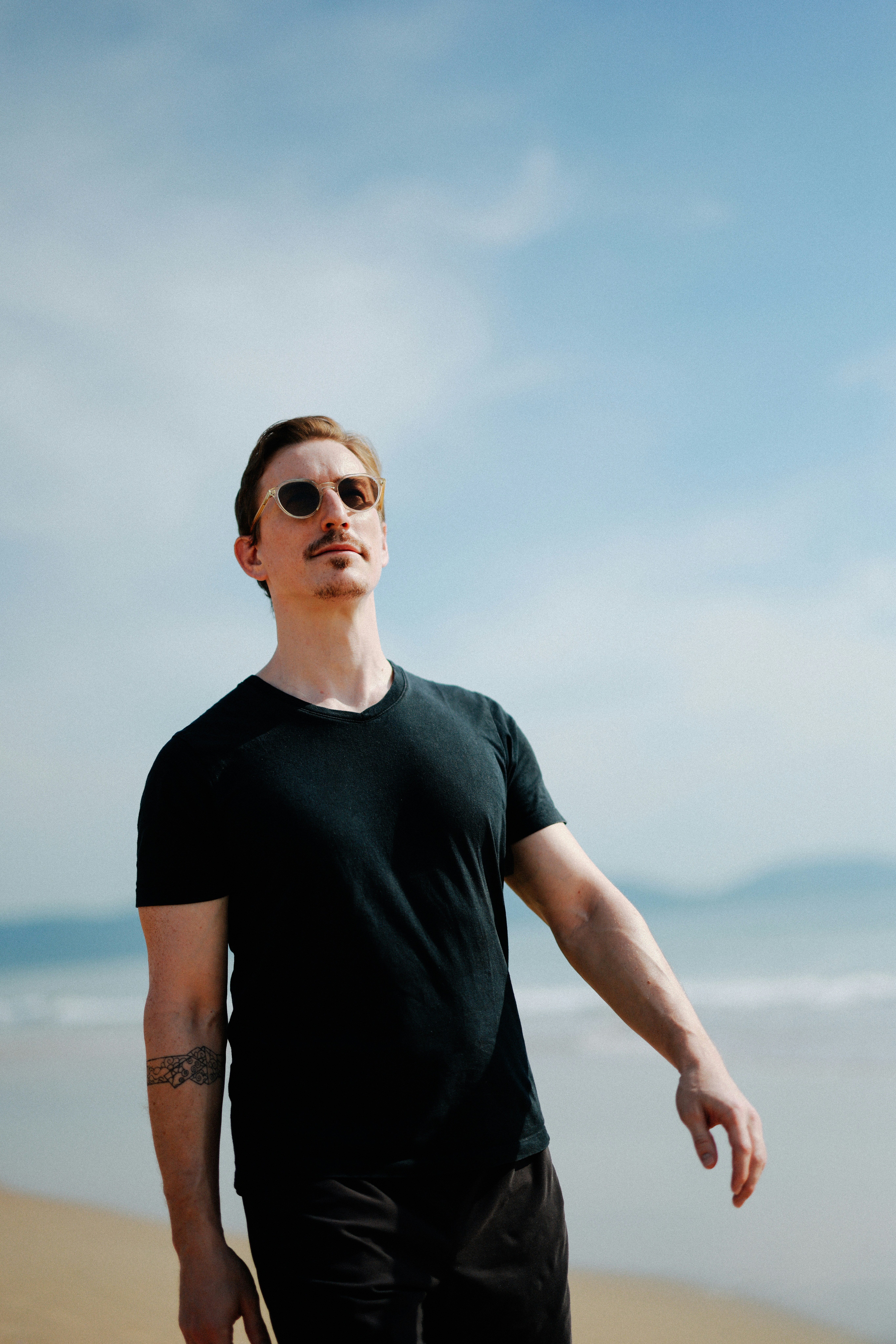 Sunlit Confidence: A Beach Portrait in Simple Silhouettes