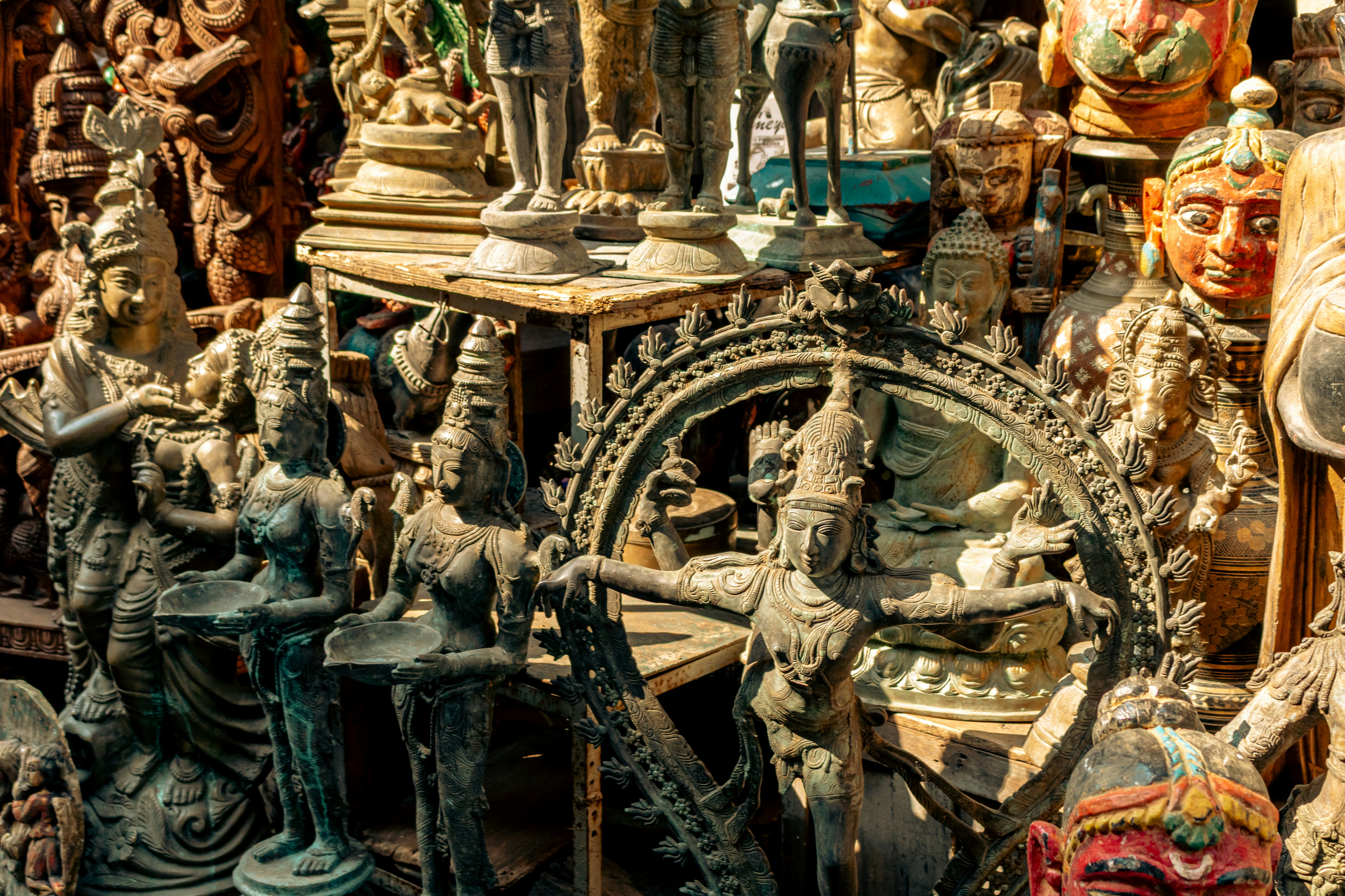 Wooden and metal sculptures at an antique store in Chor Bazaar, one of the largest flea markets in India, located on Mutton Street, near Bhendi Bazaar in Grant Road, South Mumbai.