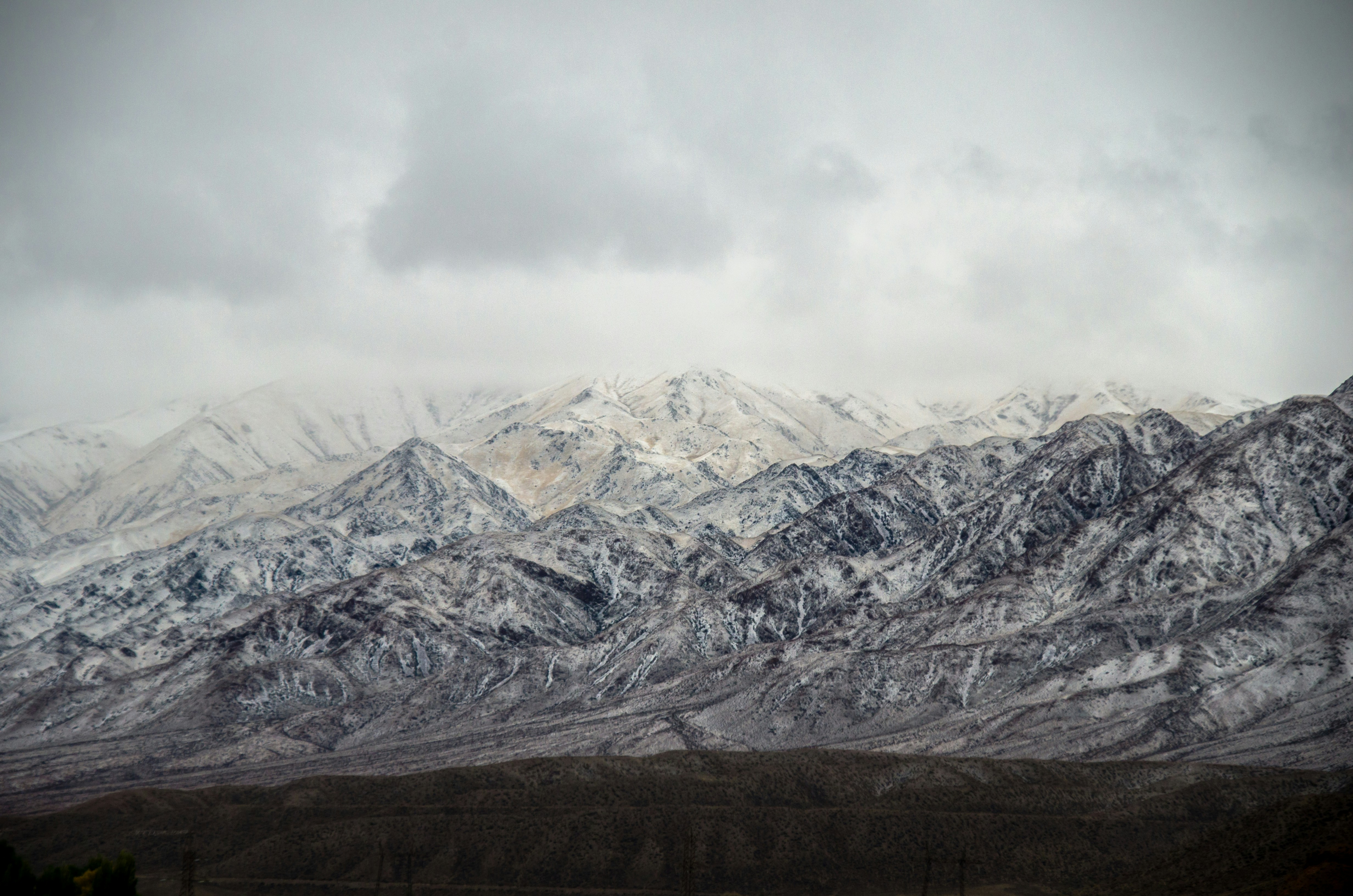 Snow-kissed Ridgeline under a Storm-brushed Sky