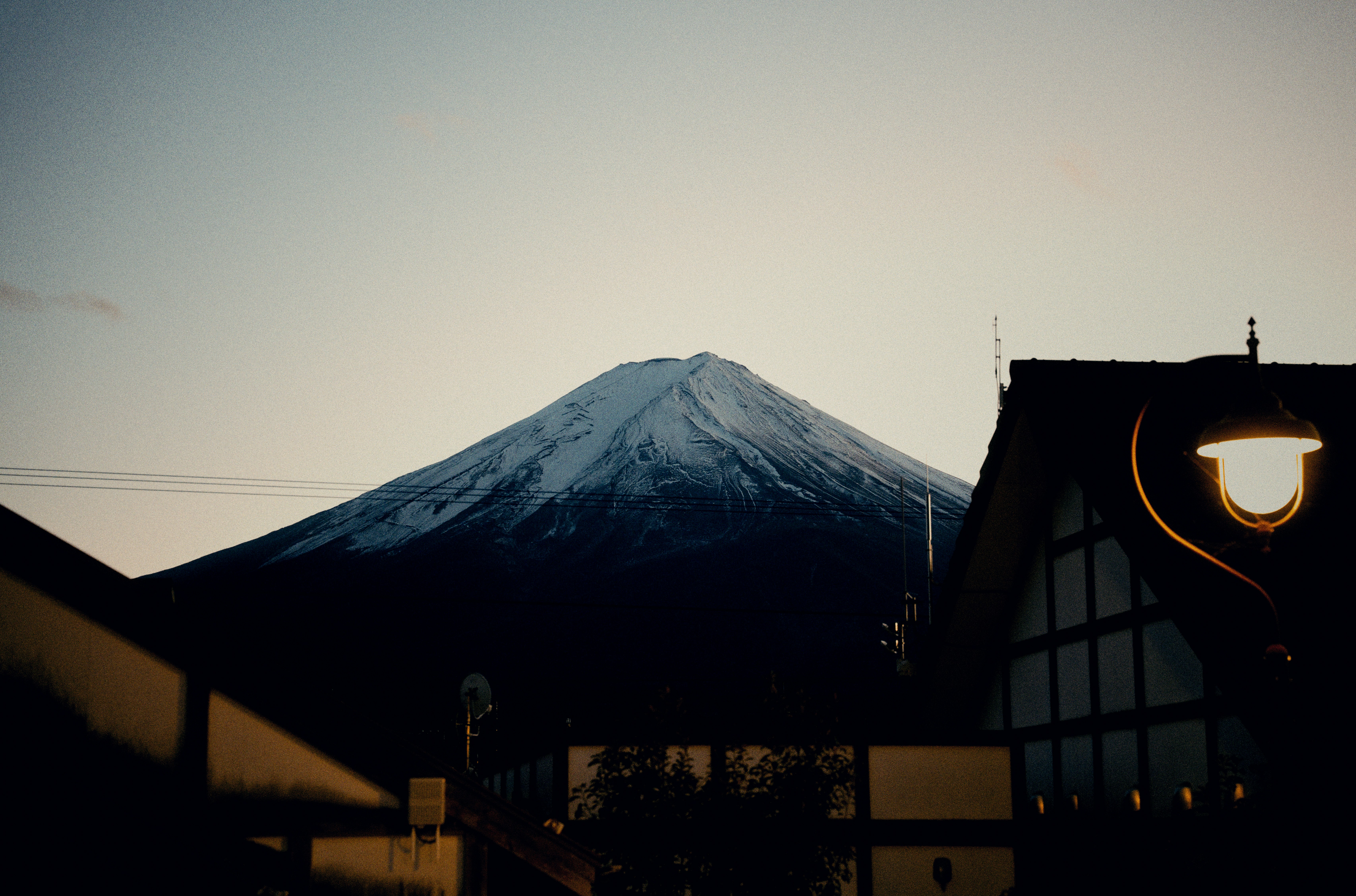 Snow-capped Peak Between Quiet Town Lights
