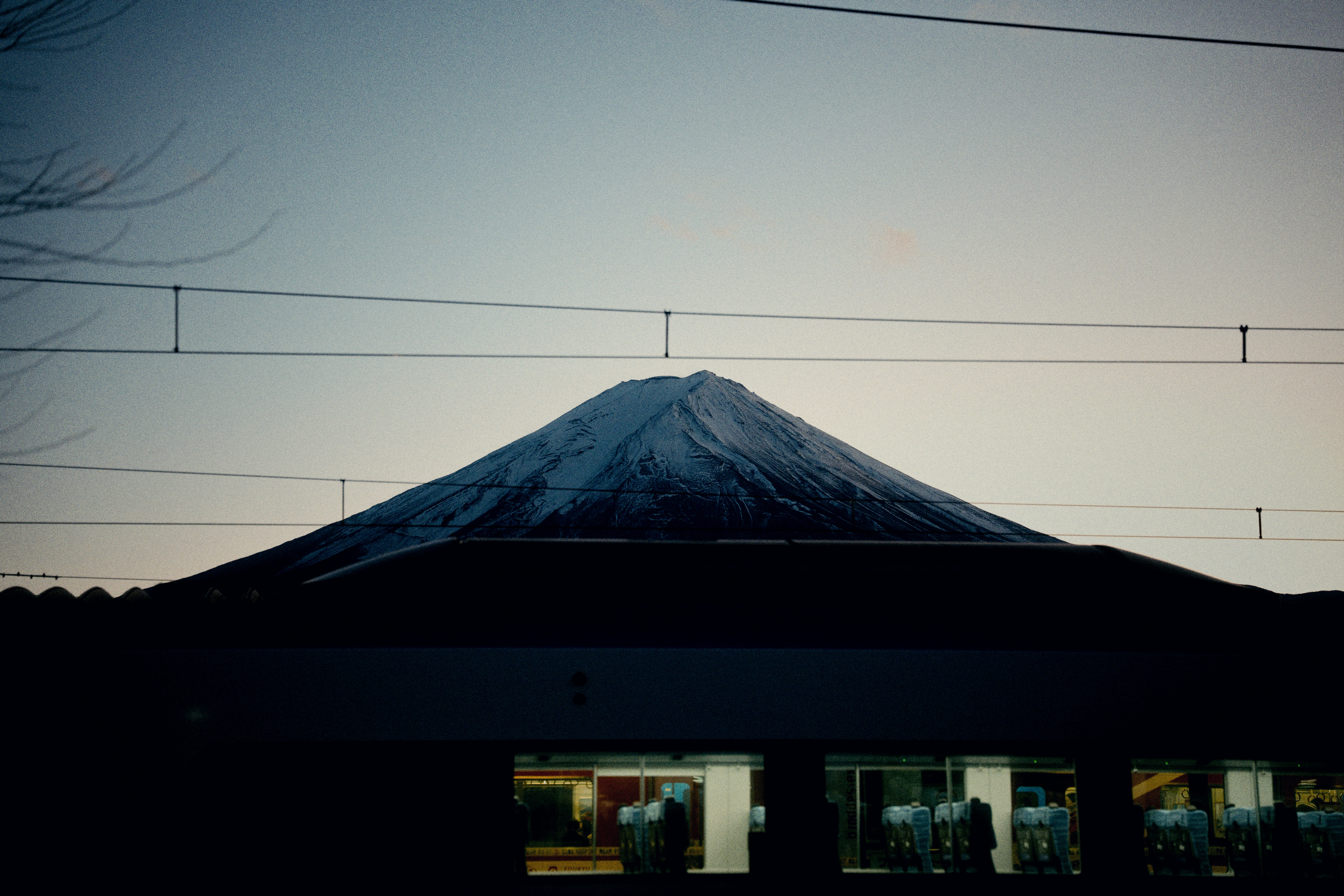 Snow-Topped Summit Beyond the Quiet Train Depot