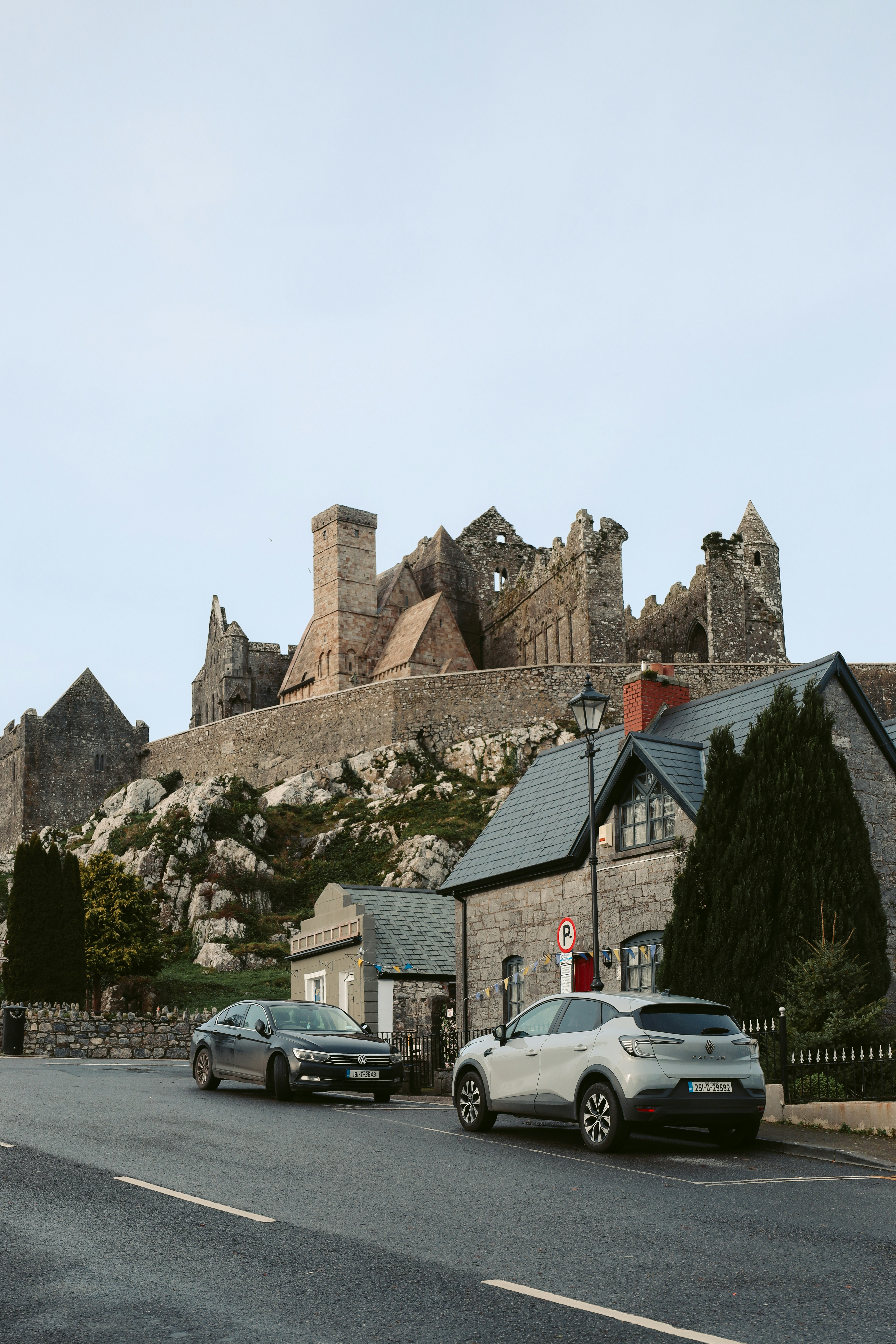 Castle Ruins Above a Quiet Village Street