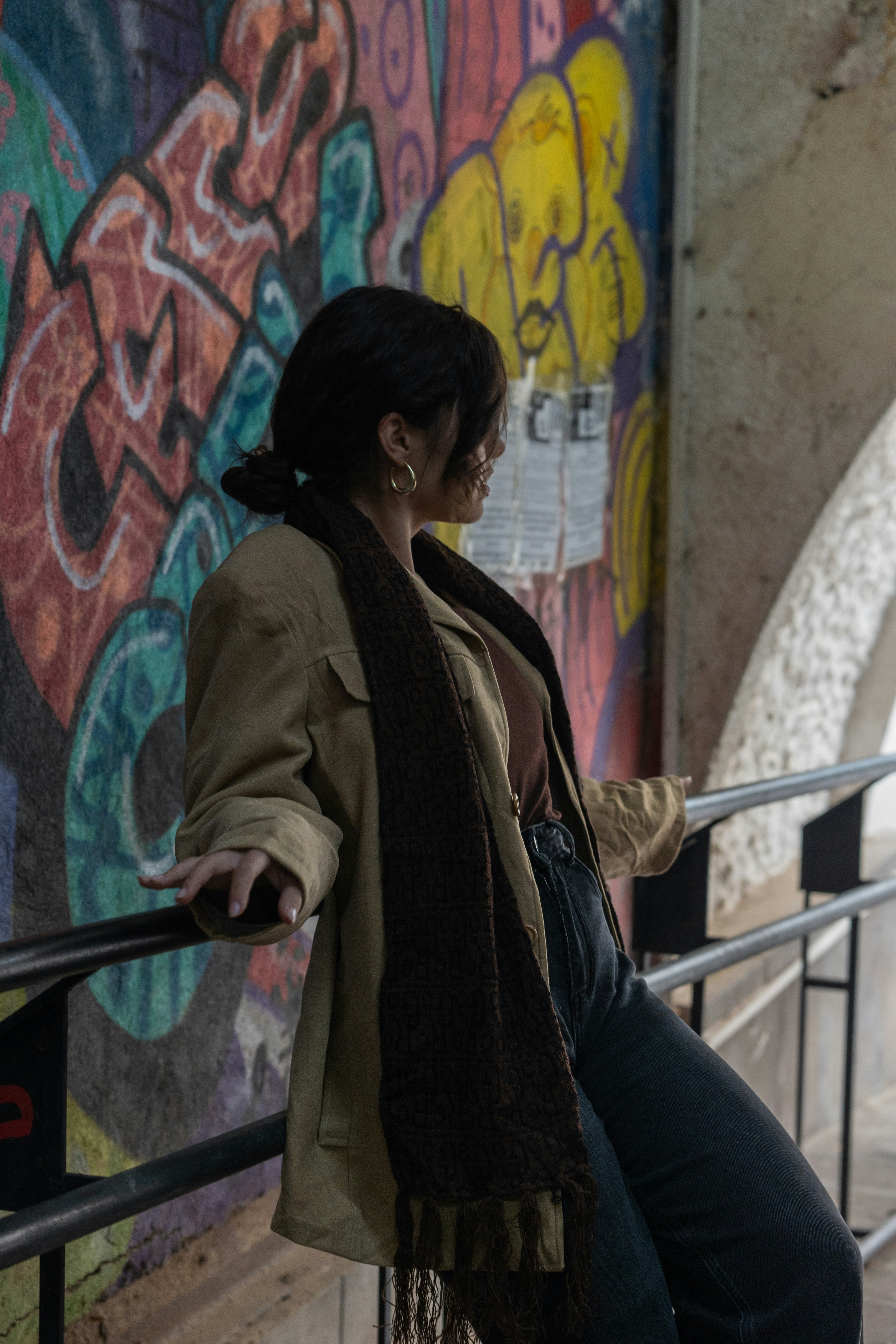 Against the Wall of Color: A Portrait paused in Graffiti Light