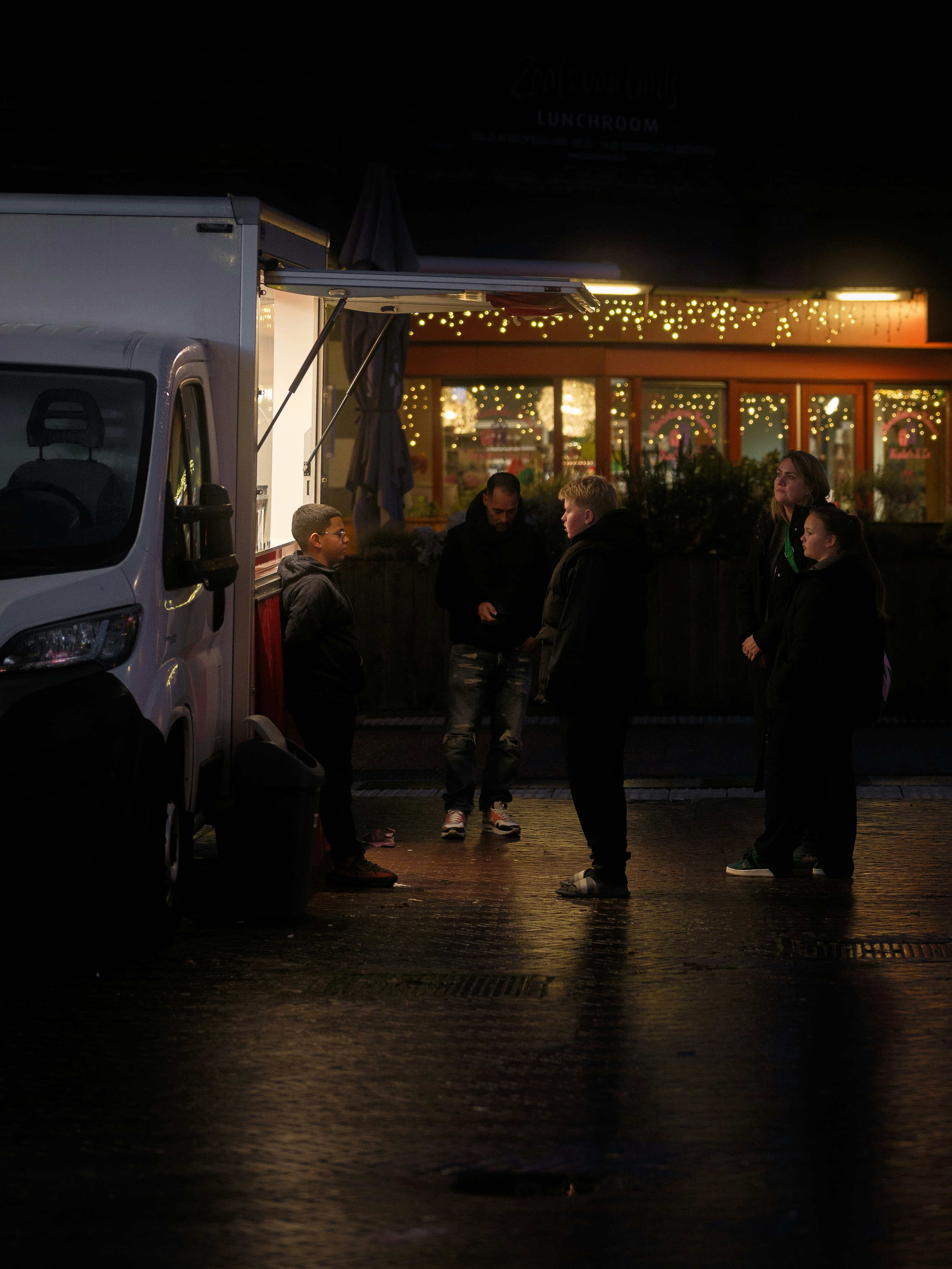 People gathered around a Foodtruck on Christmas