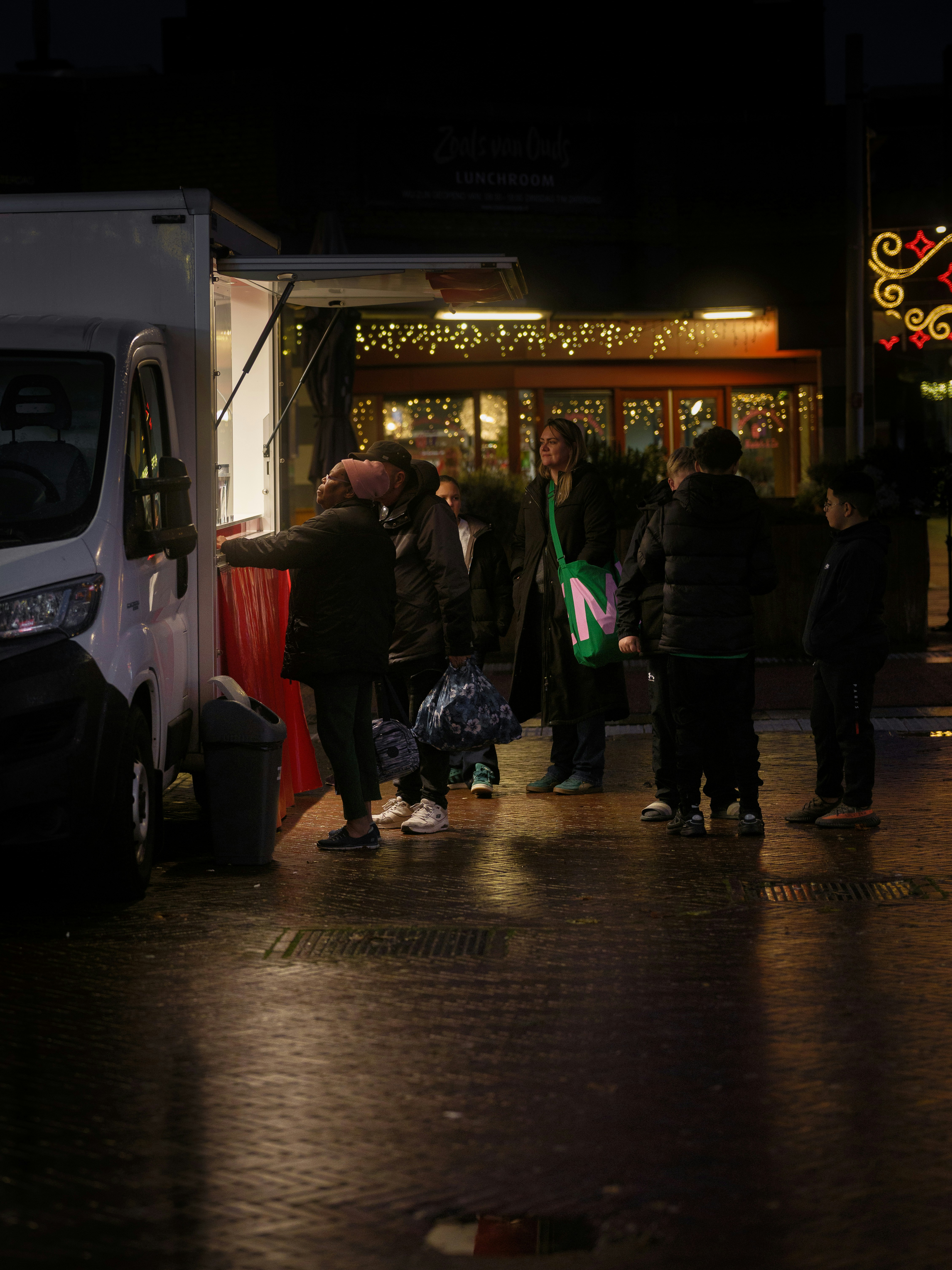 People gathered around a Foodtruck on Christmas
