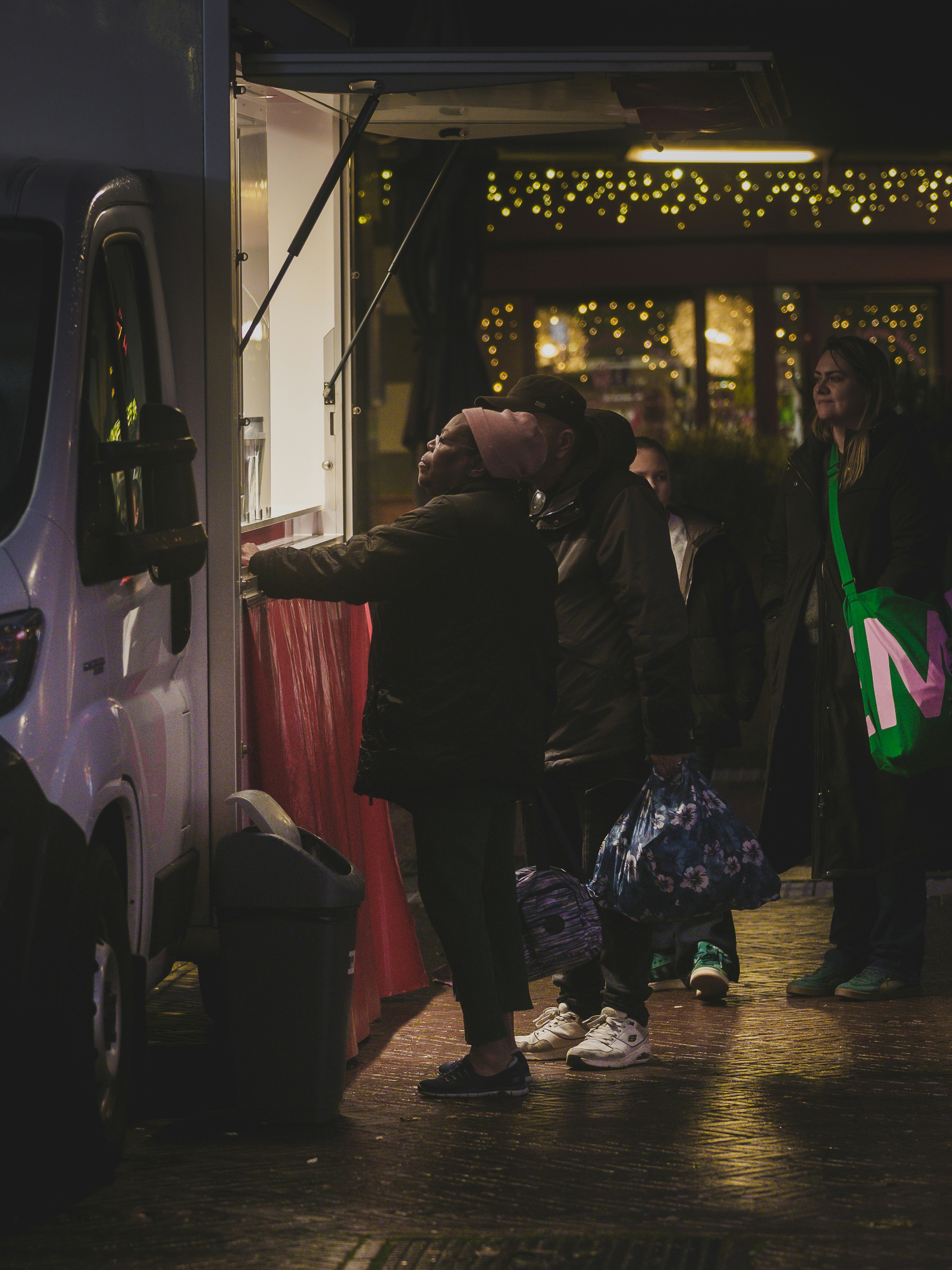 People gathered around a Foodtruck on Christmas
