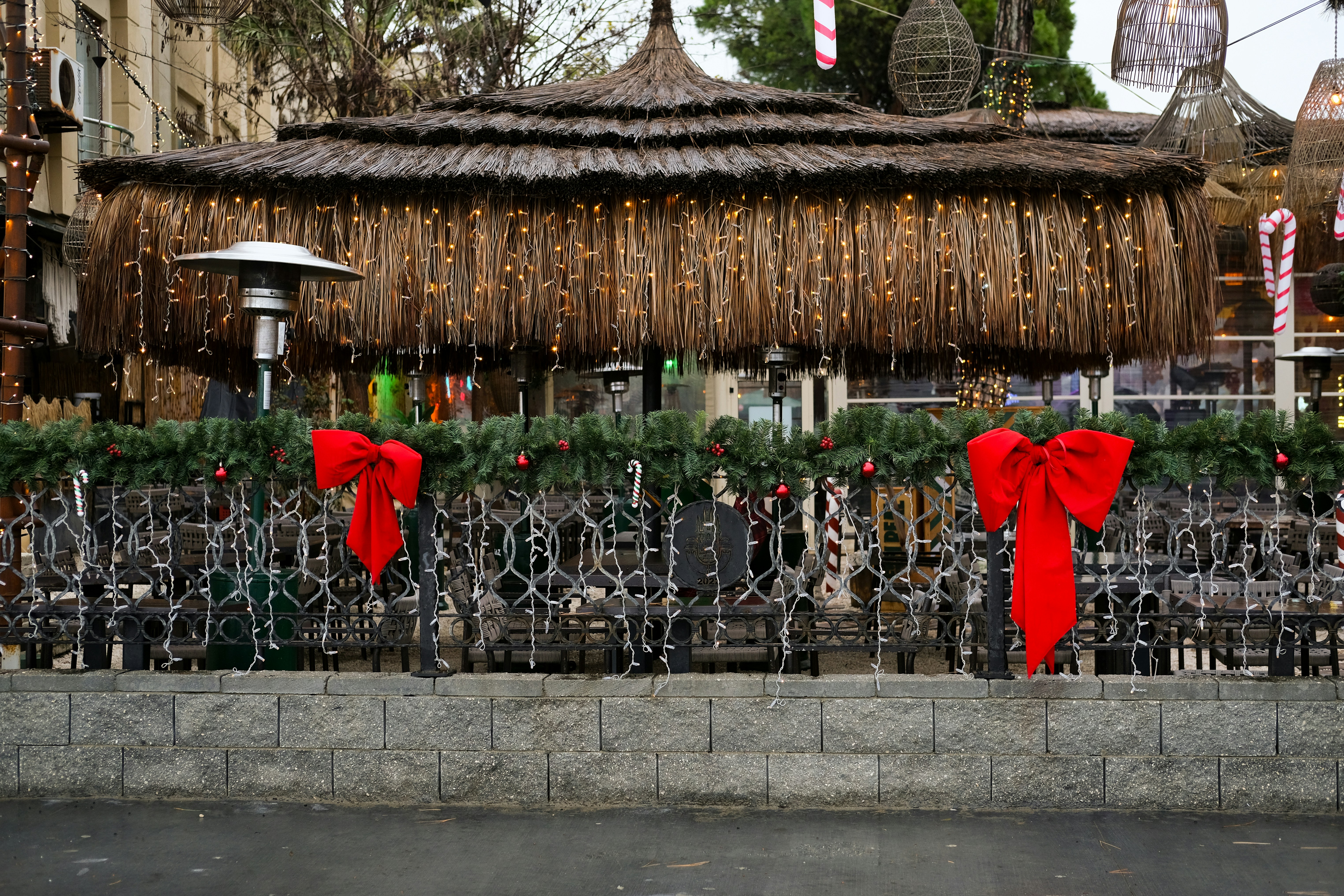 Red Bow Festoon: A Cozy Holiday Corner by the Hut