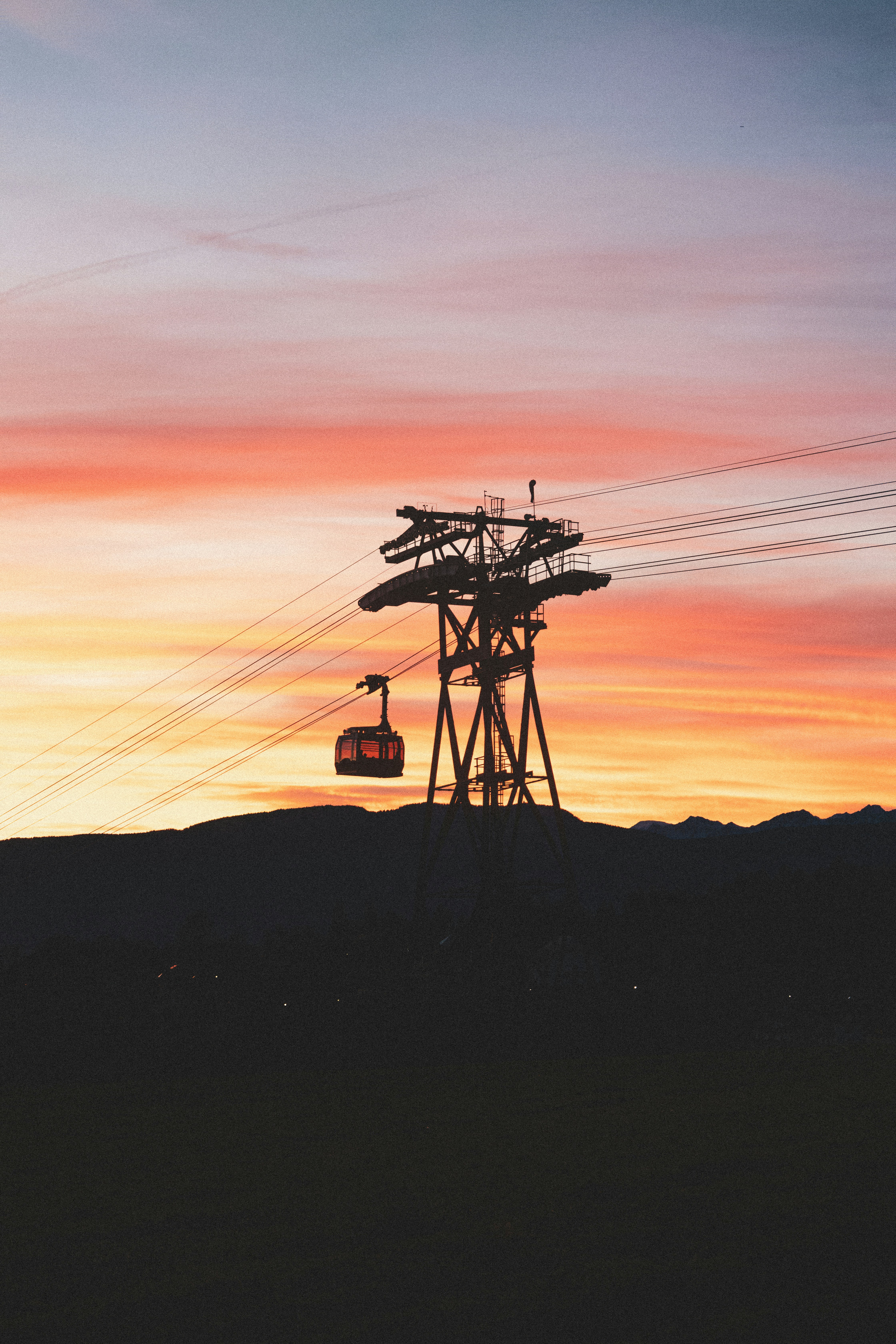  Sunset Lift: A Cable Car Silhouette Against a Fiery Sky