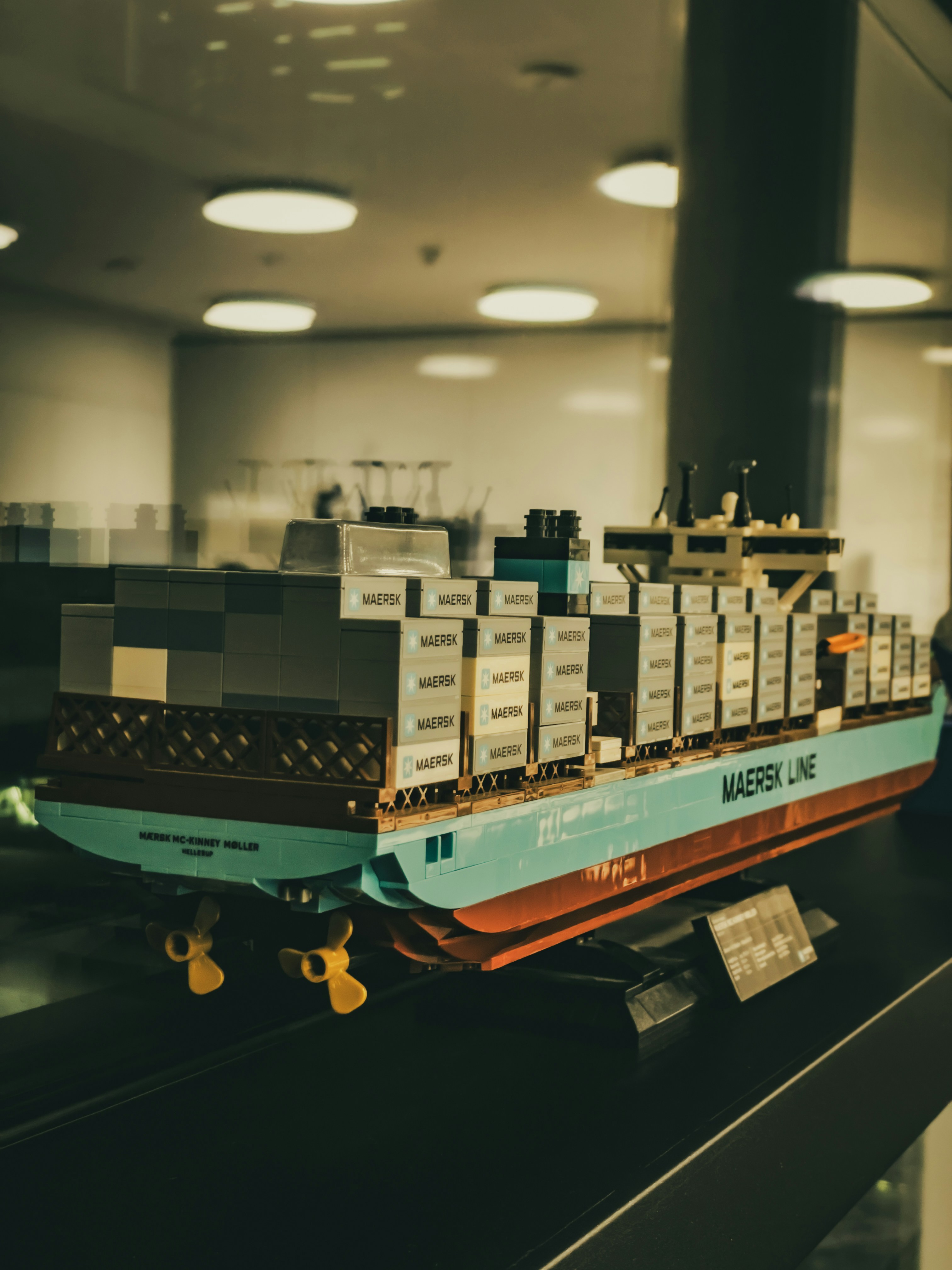Maersk Line in Miniature: A Delicate Cargo Vessel on Display