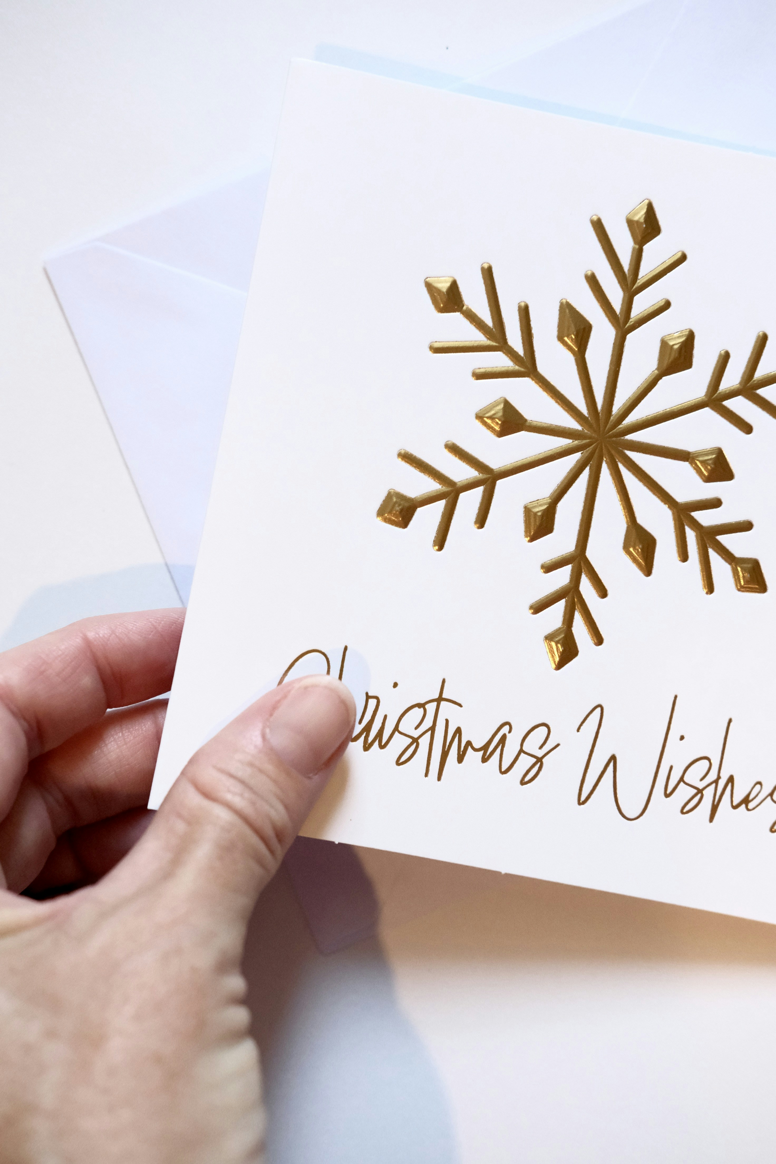 Golden Snowflake Card in Gentle Hands