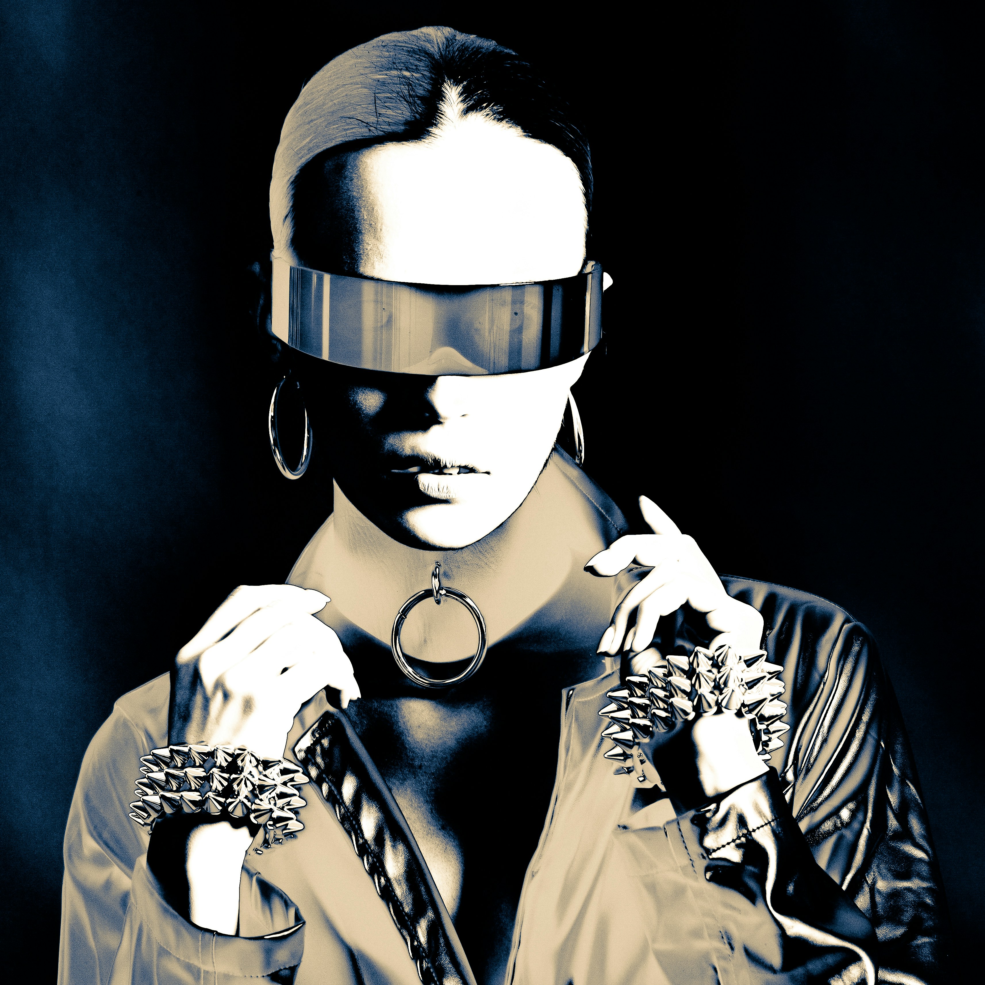 Woman with futuristic visor and jewelry