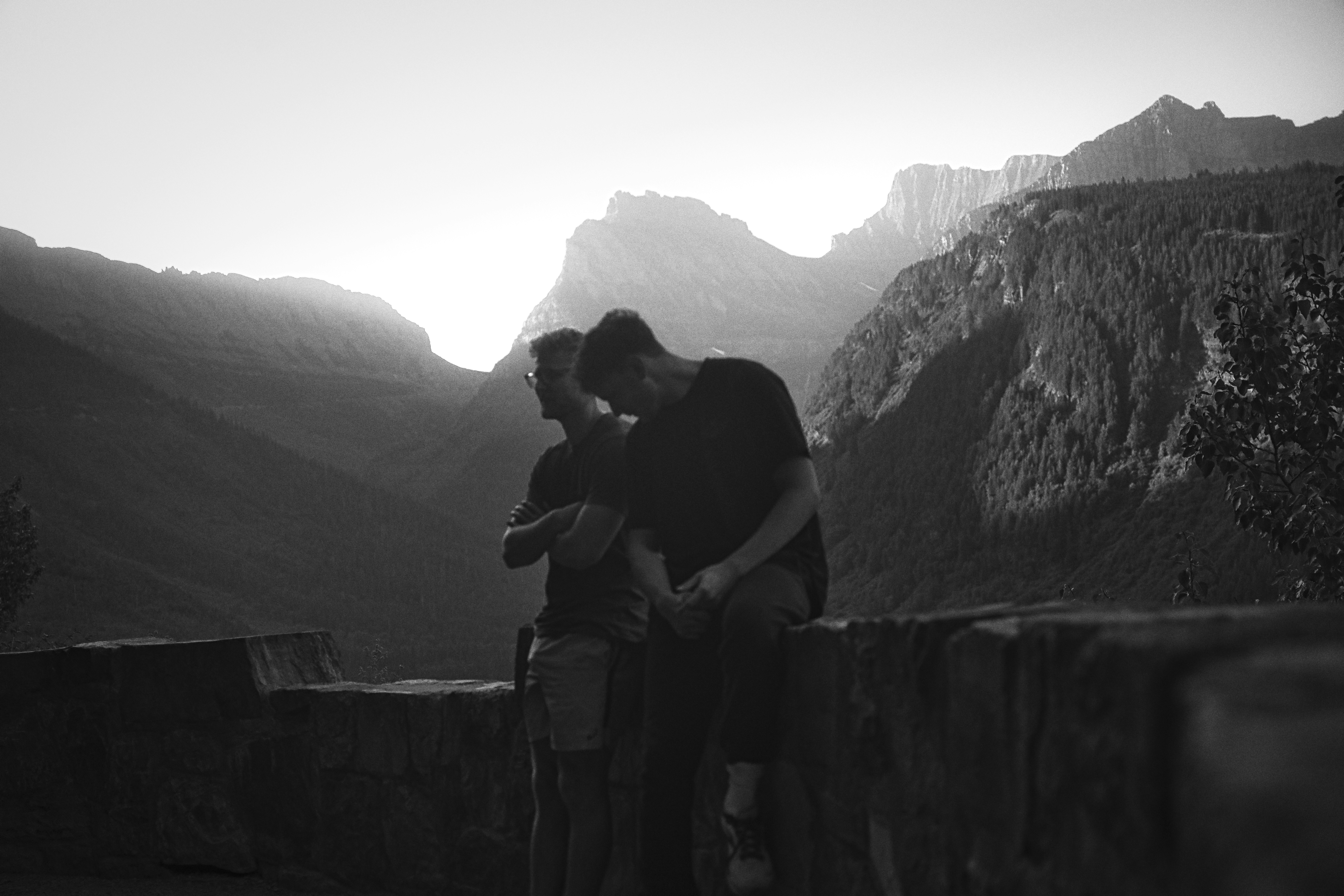 Two Silhouettes at Dusk Over Mountain Vales