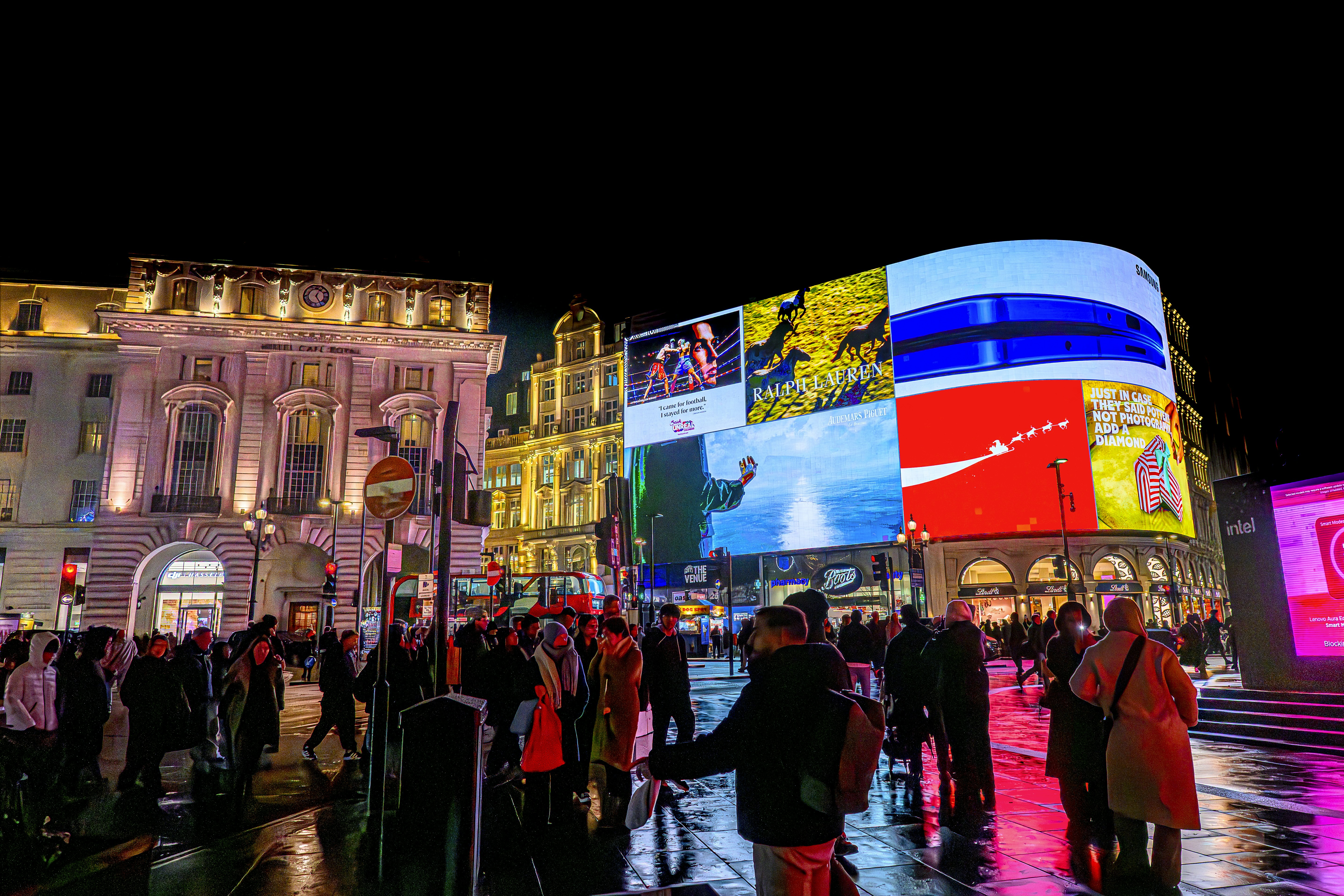 Neon Pulse in Piccadilly: Nighttime Crowd at the Digital Square