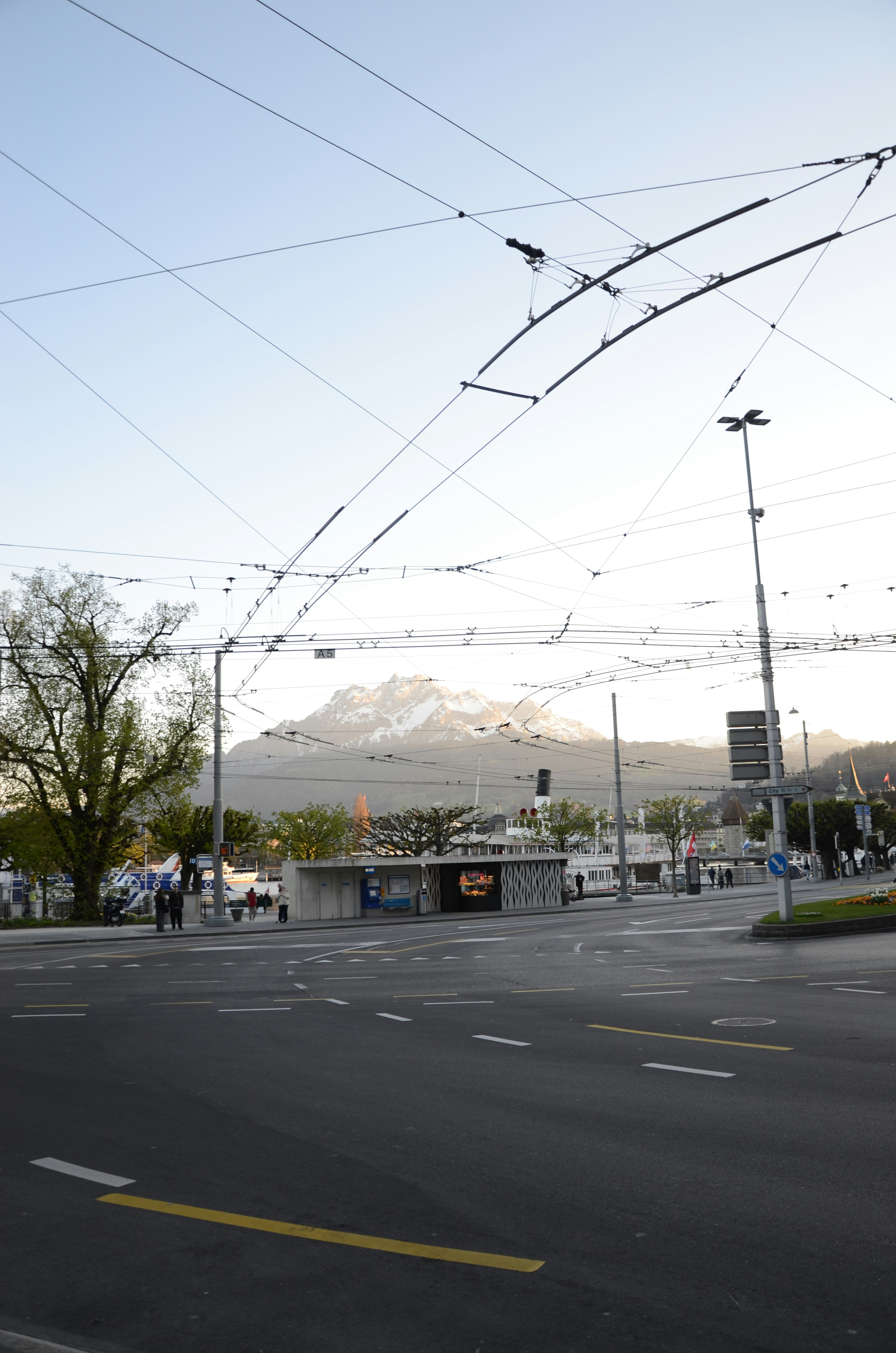 Overhead Tram Lines Framing a Mountain Dawn