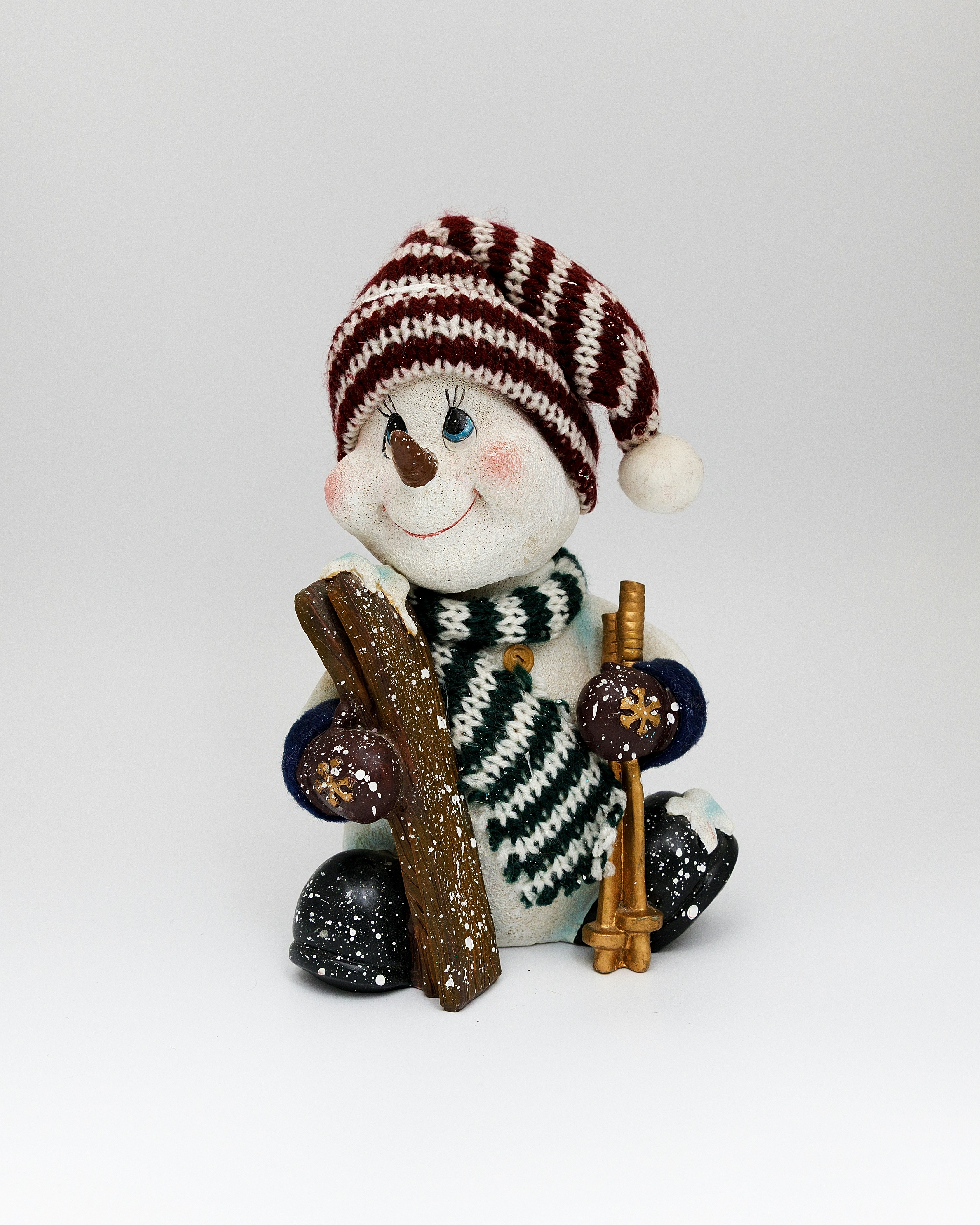 Cozy Winter Snowman Figurine with Log and Gold Staff