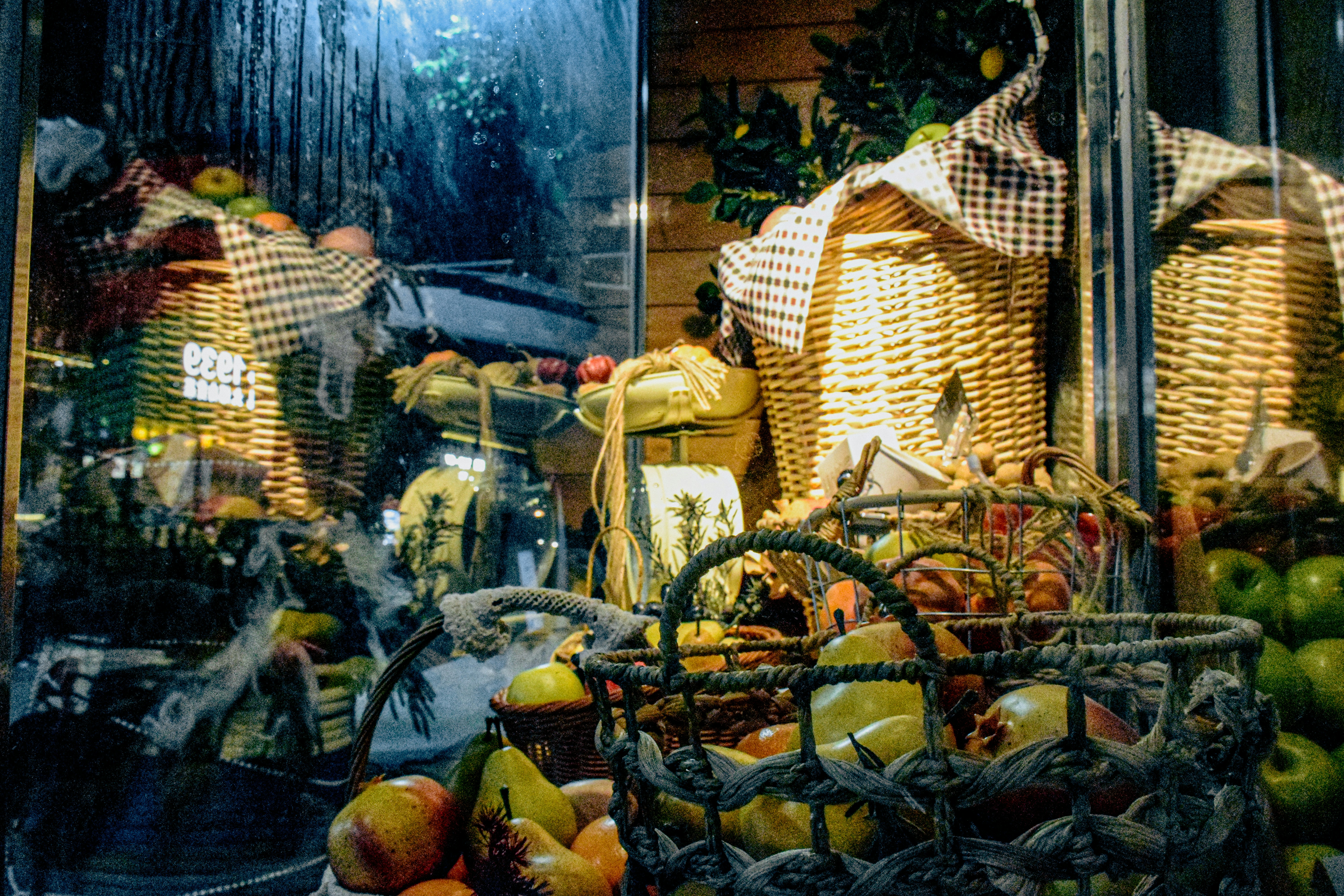 Fruit Stand in a Rain-Soaked Window