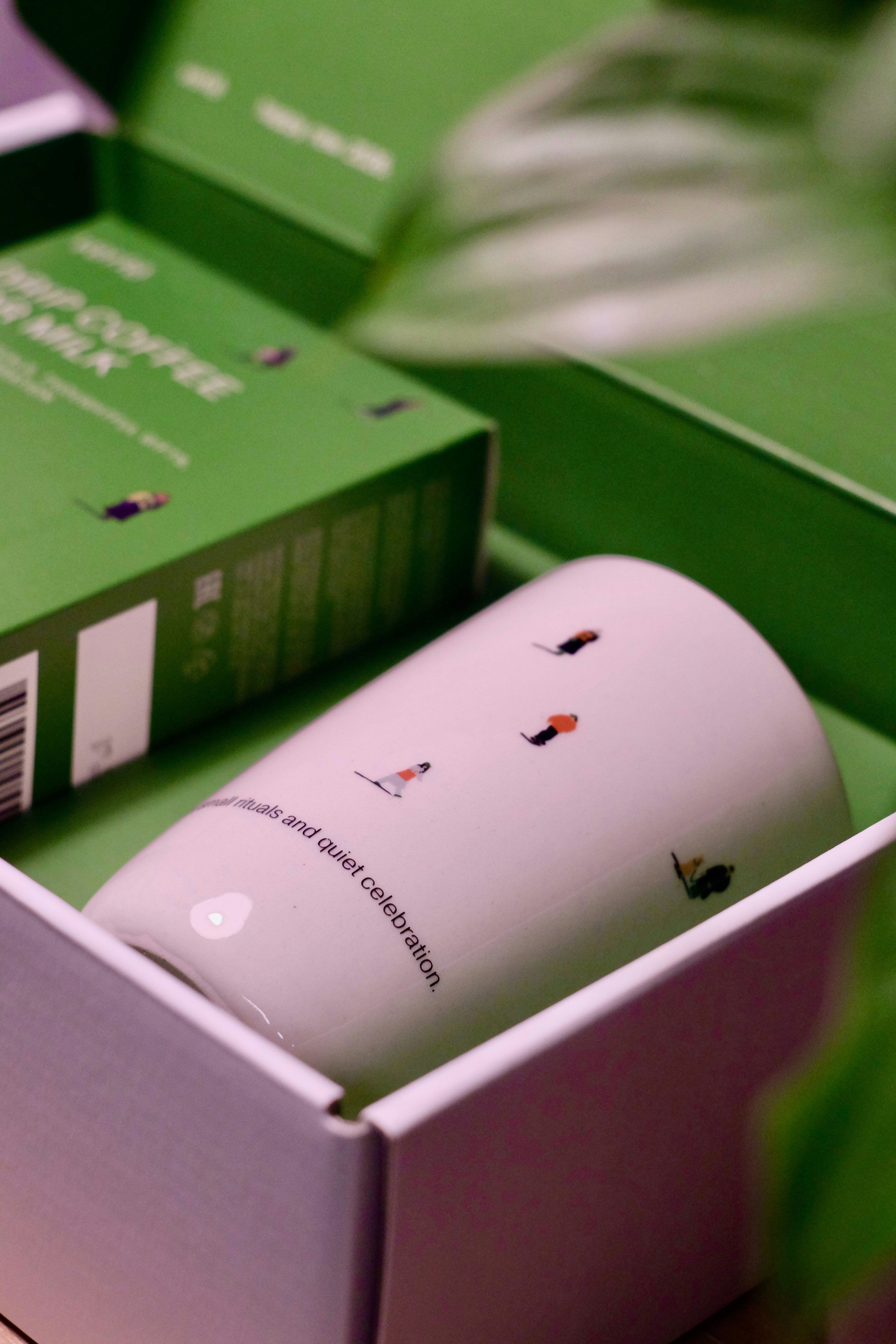 Green-package treasure: a close-up of a mug nestled among lime boxes