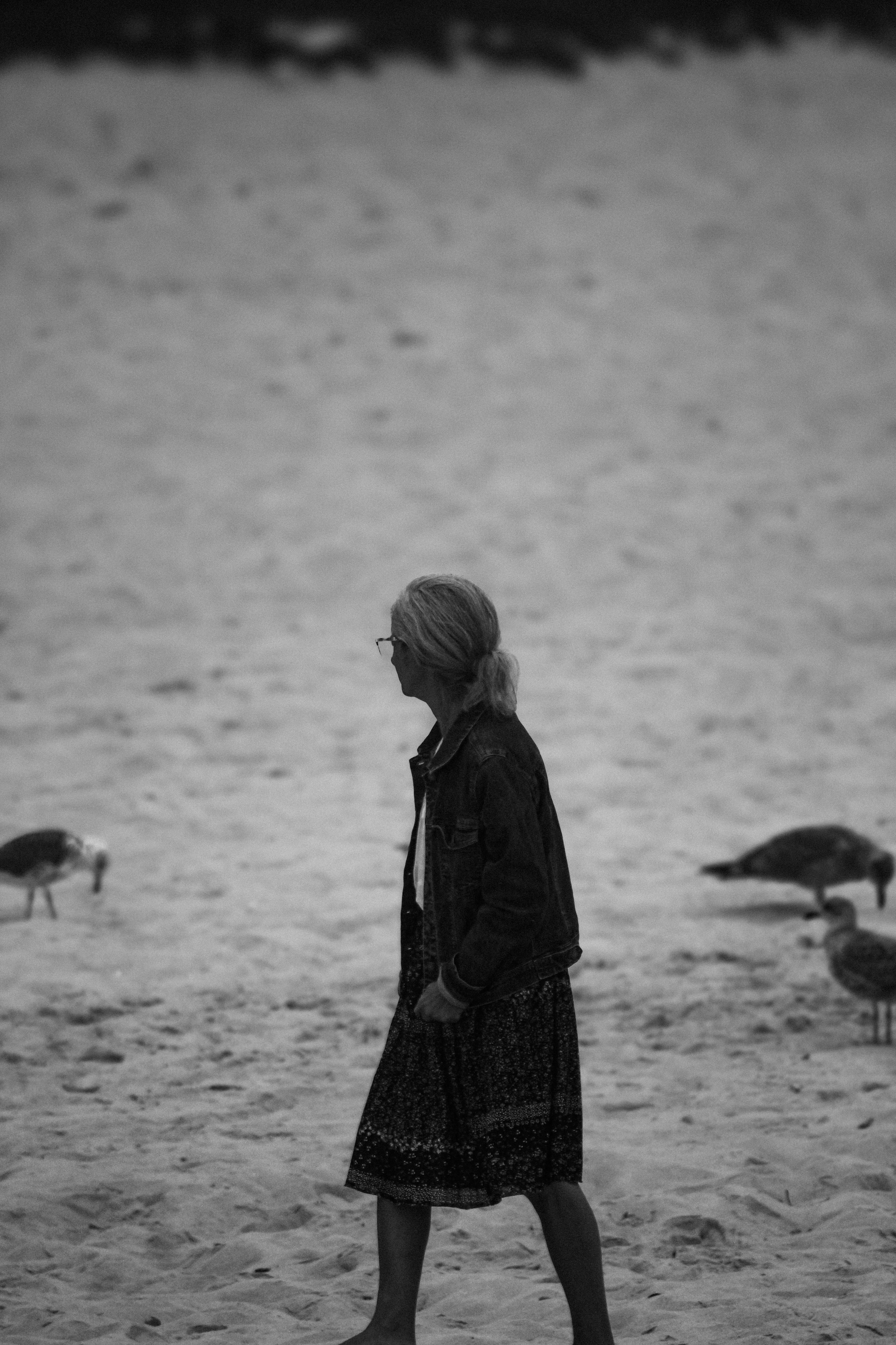 Solitary Walk on the Shoreline: A Portrait in Mono