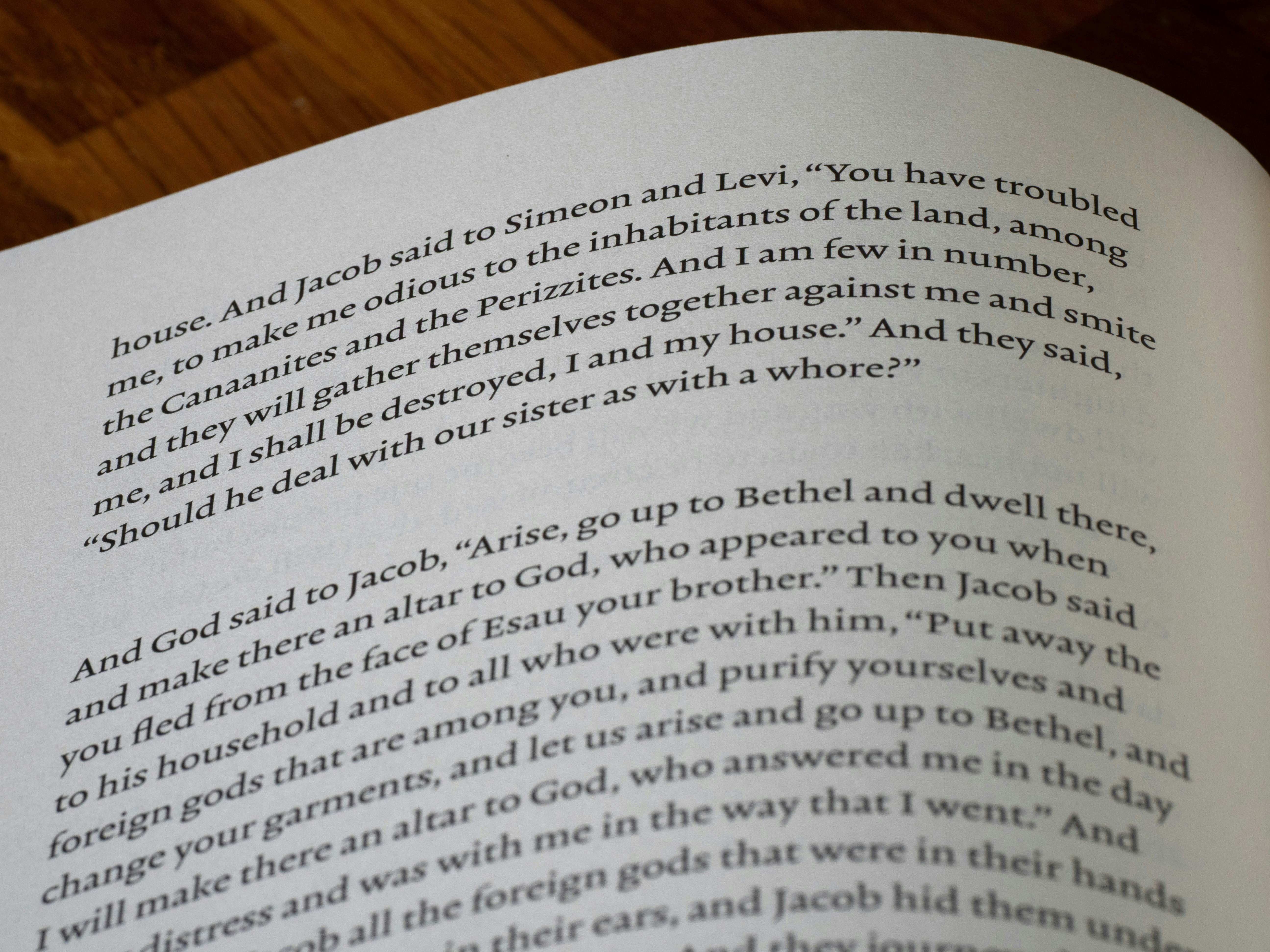 Curved Pages, Silent History: A Close-Up of Inked Script on a Book's Edge