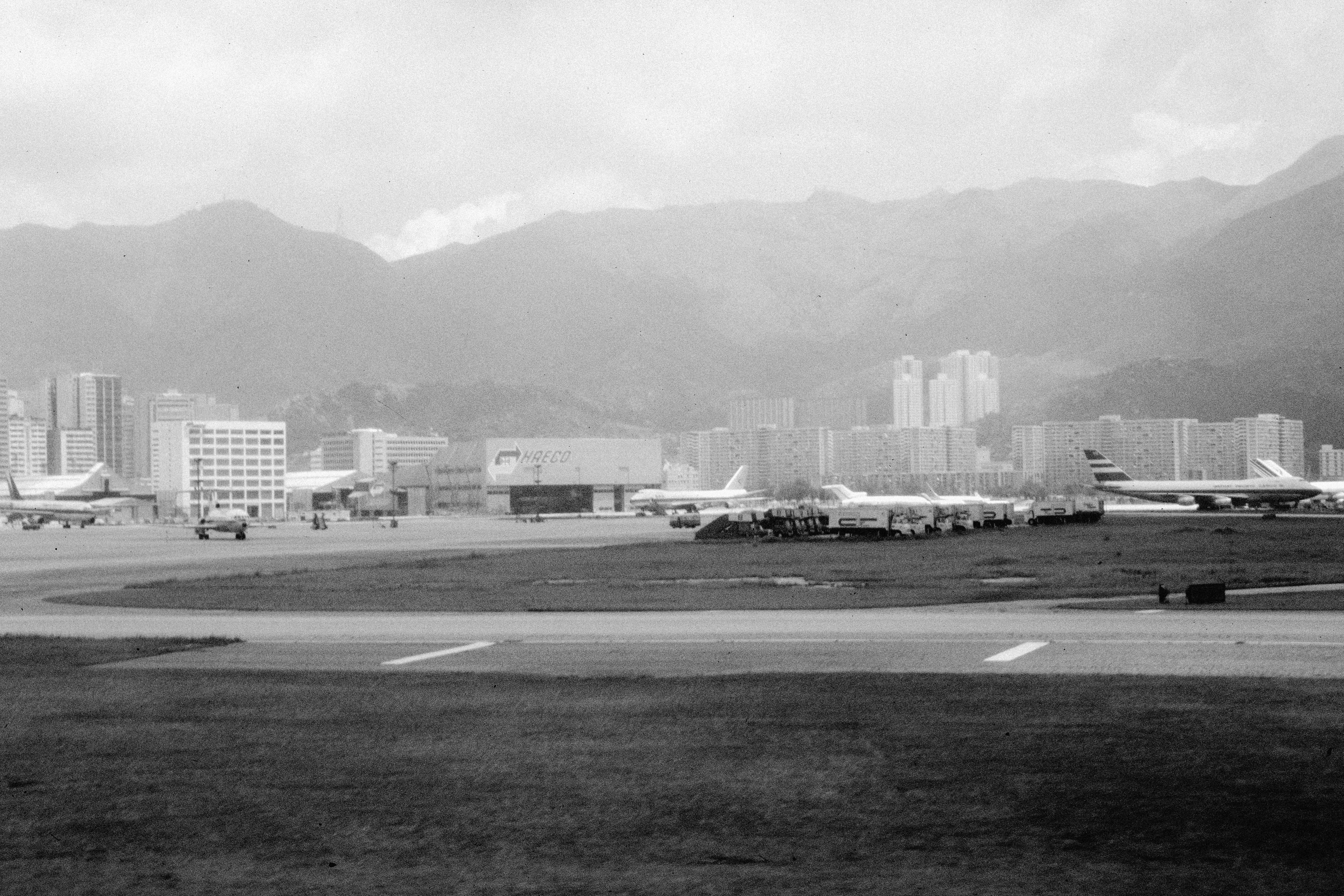 Silhouetted Runways and Mountain Backdrop at a Quiet Airport
