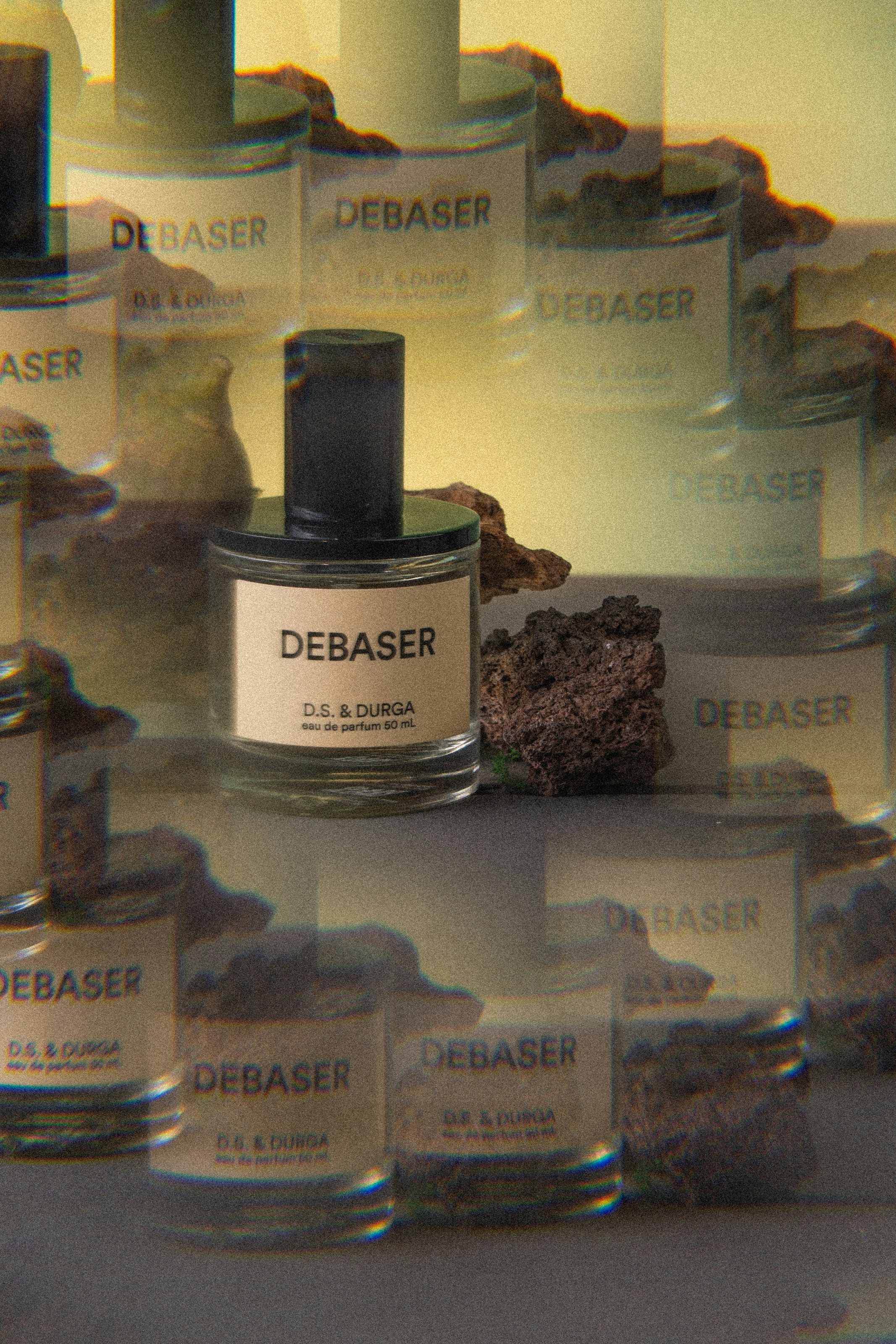 Reflected Amber: Debaser Bottles in a Velvet Prism