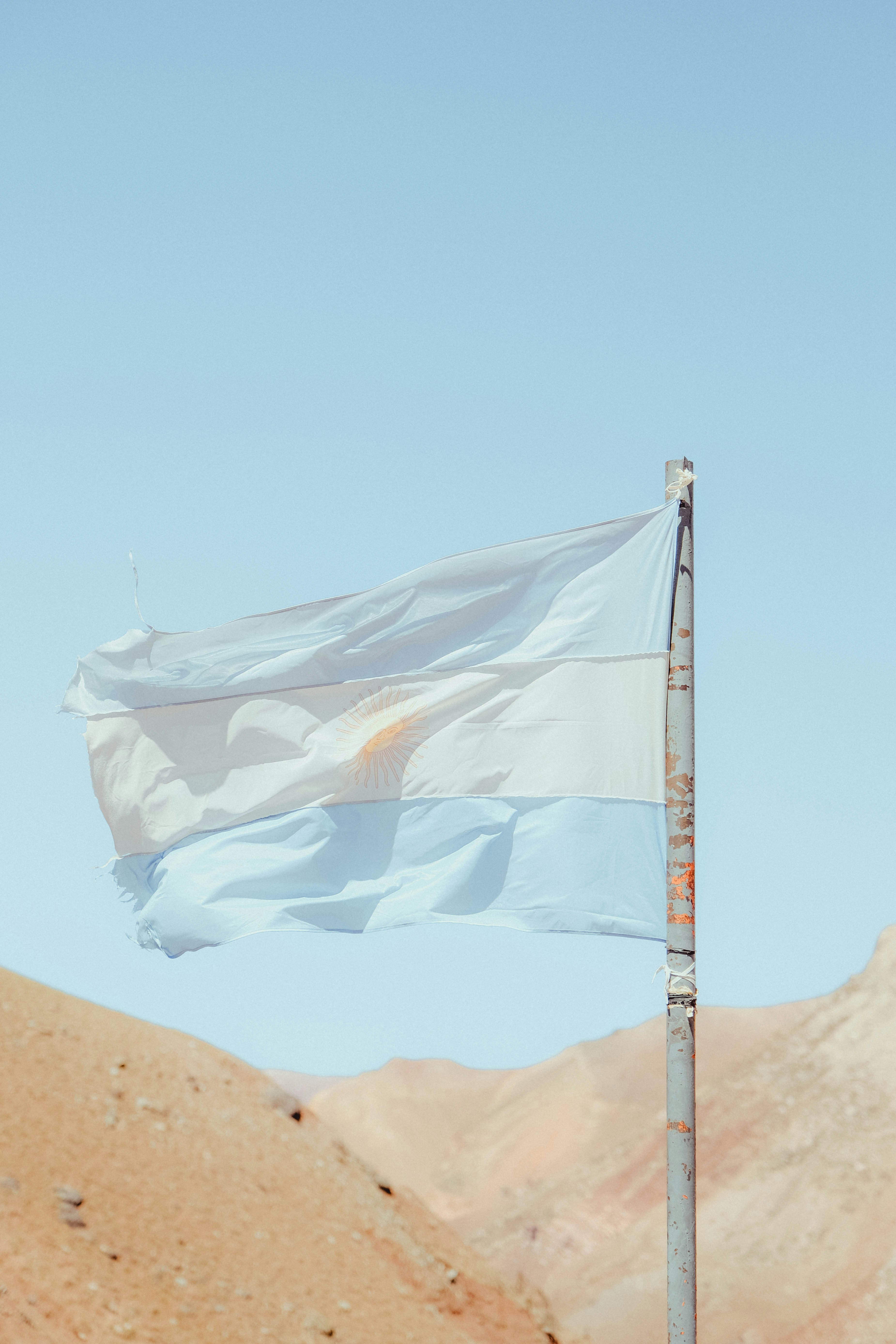 Flag in a Desert Wind Against a Clear Sky