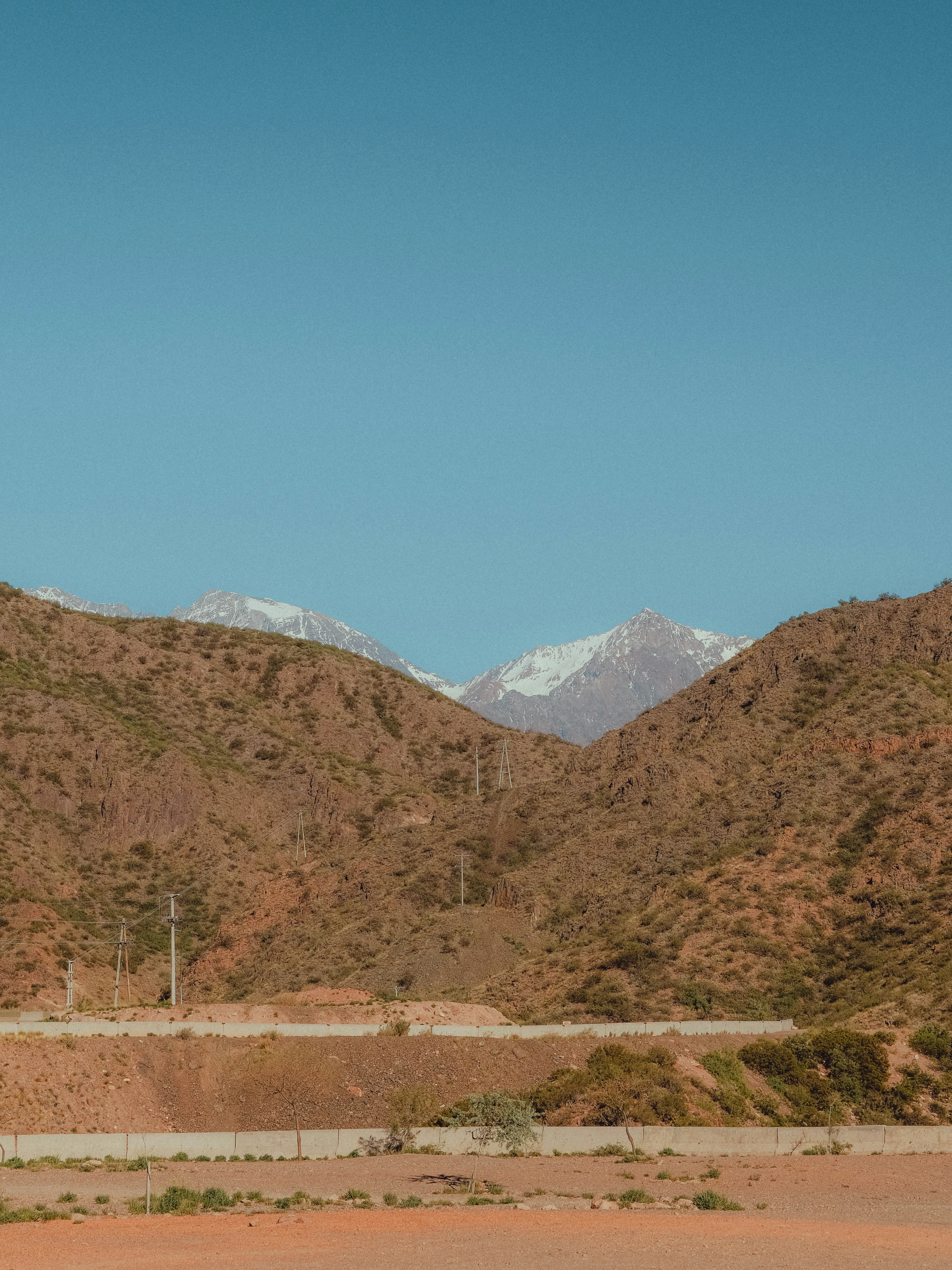 Snow-Dusted Peaks Above Desert Valleys
