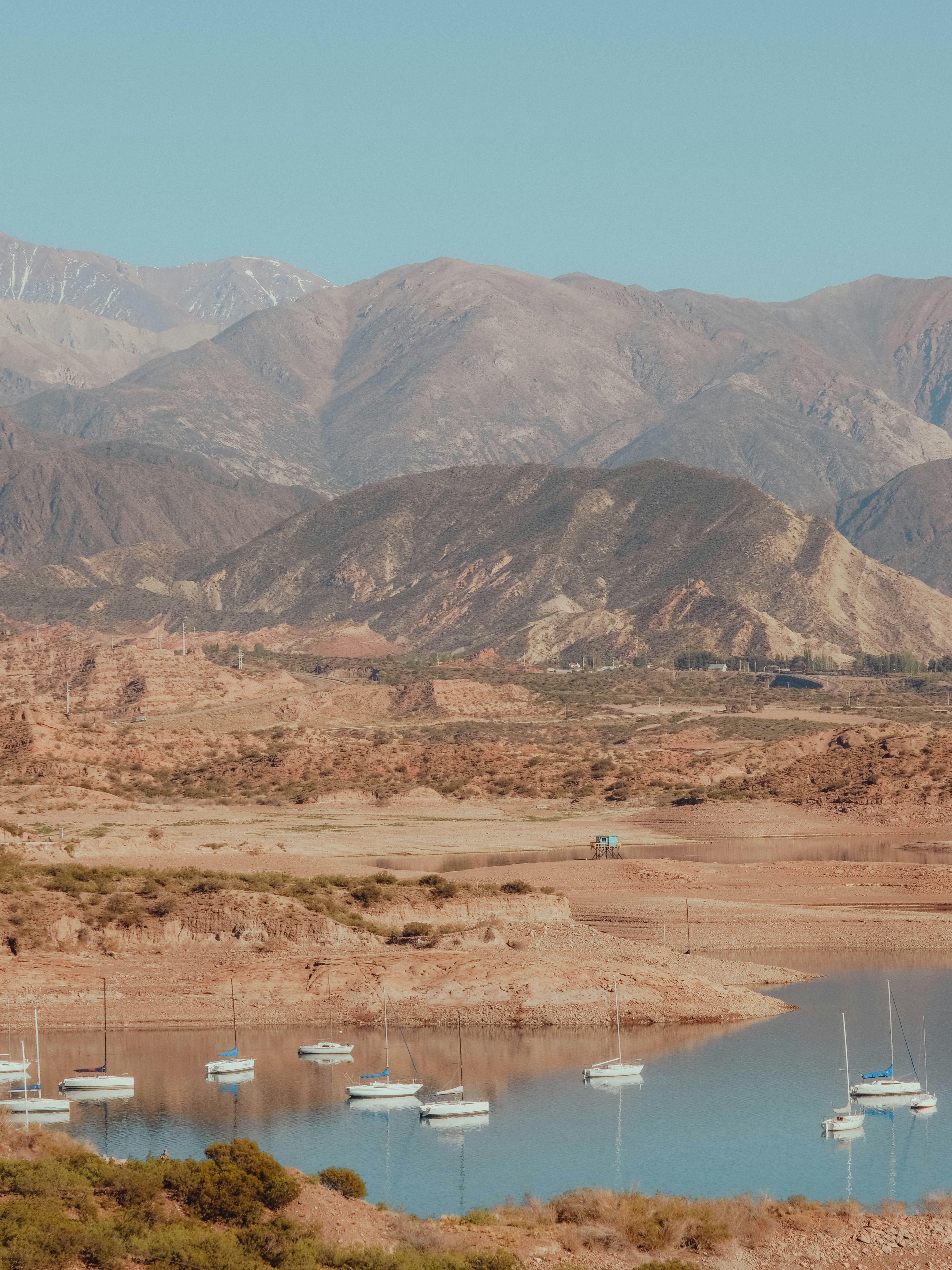 Deserted shoreline beneath a distant range