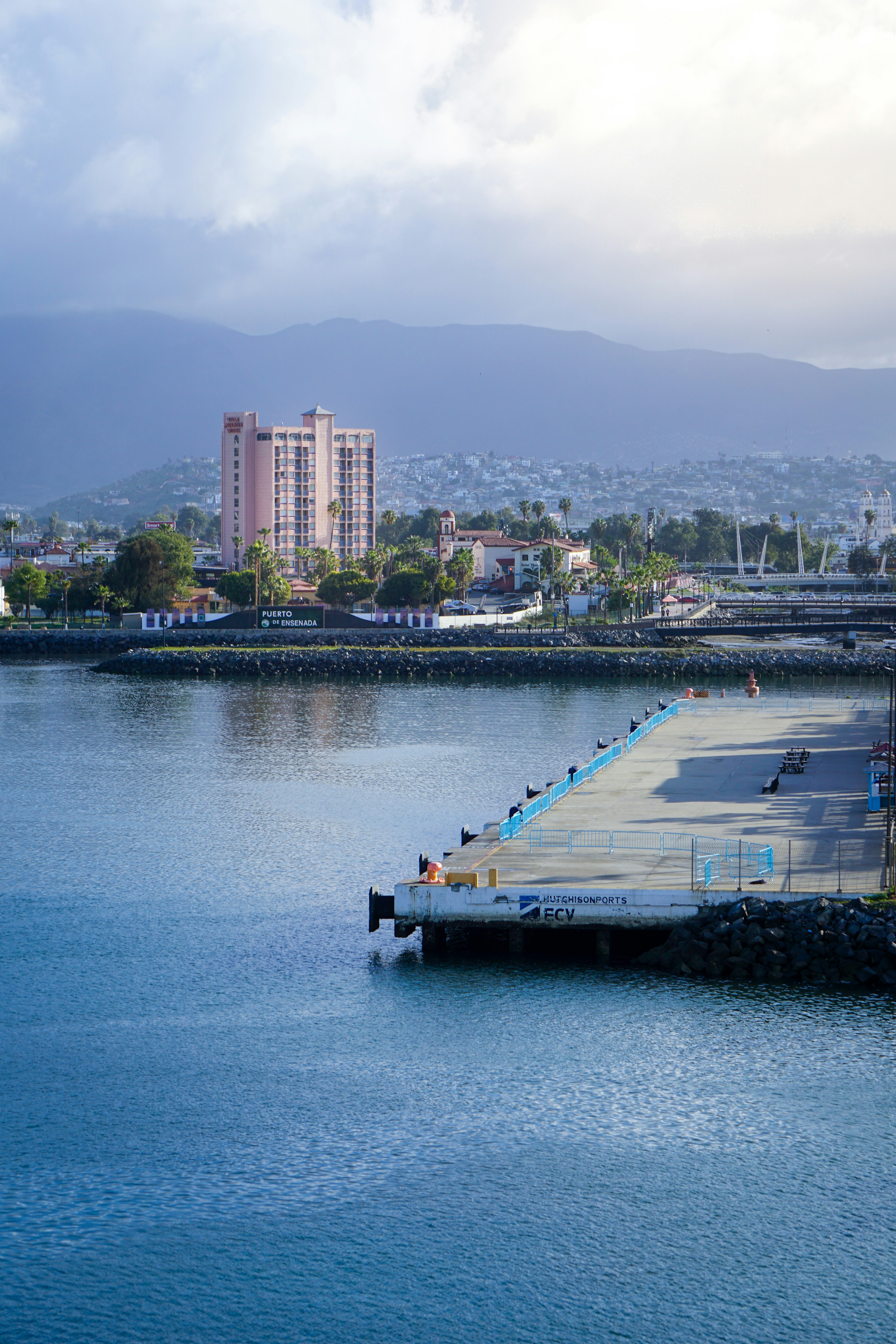 Harbor Pier Prelude: Calm Waters Meet Azure Sky