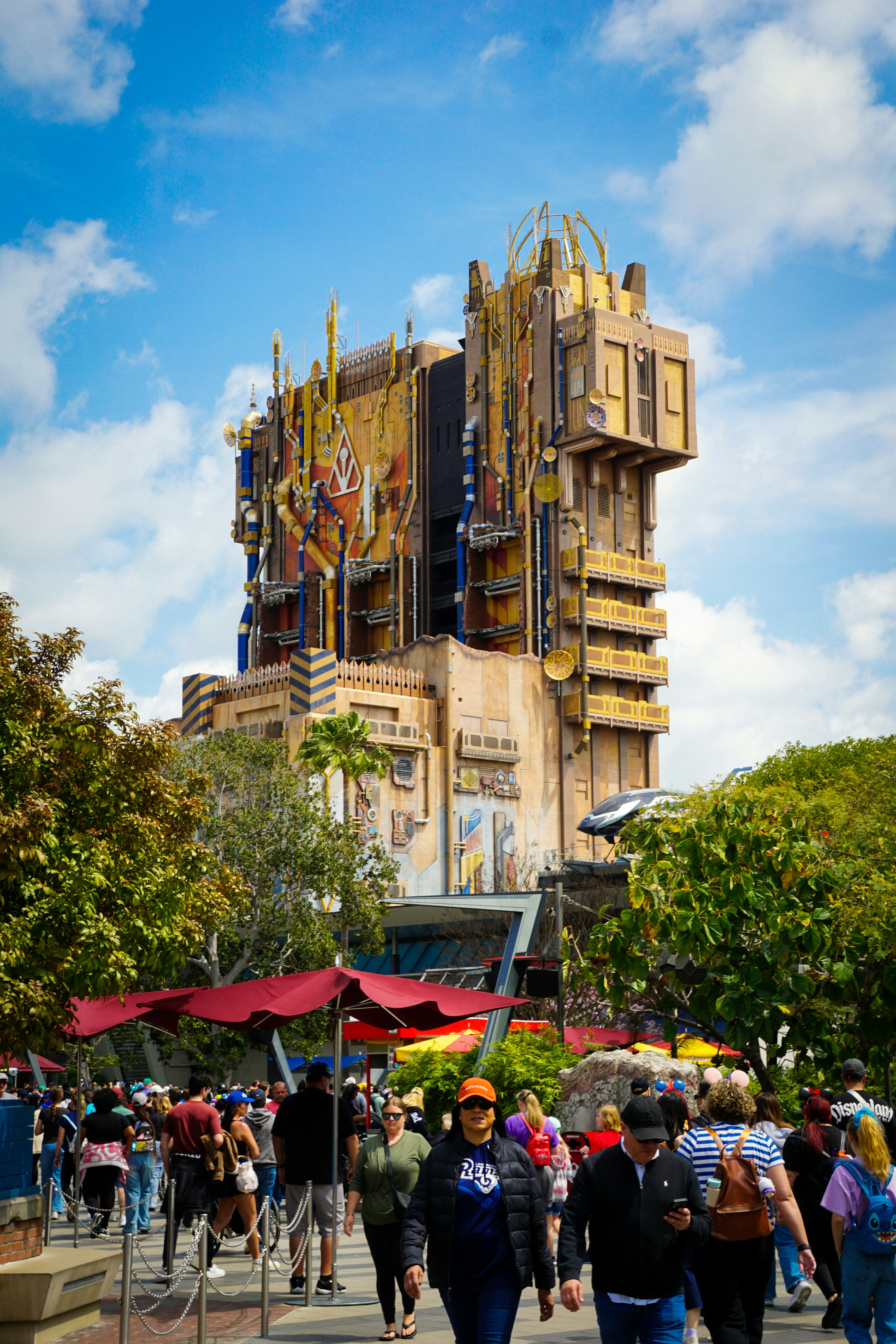 The Monolithic Ride: A Futuristic Tower Surrounded by a Bustling Plaza