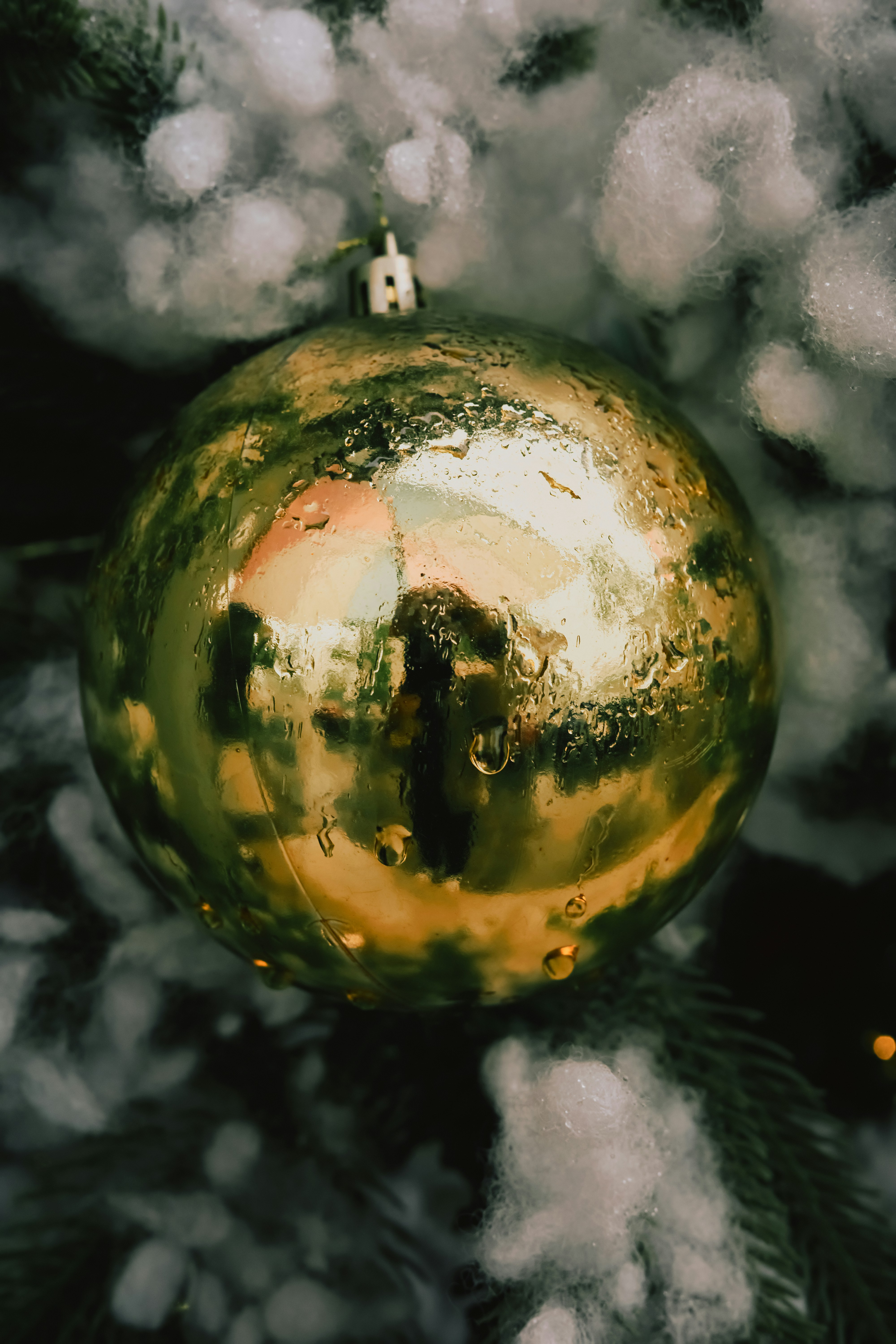 Golden Ornament: A Glimmering Christmas Sphere in Snowy Anticipation