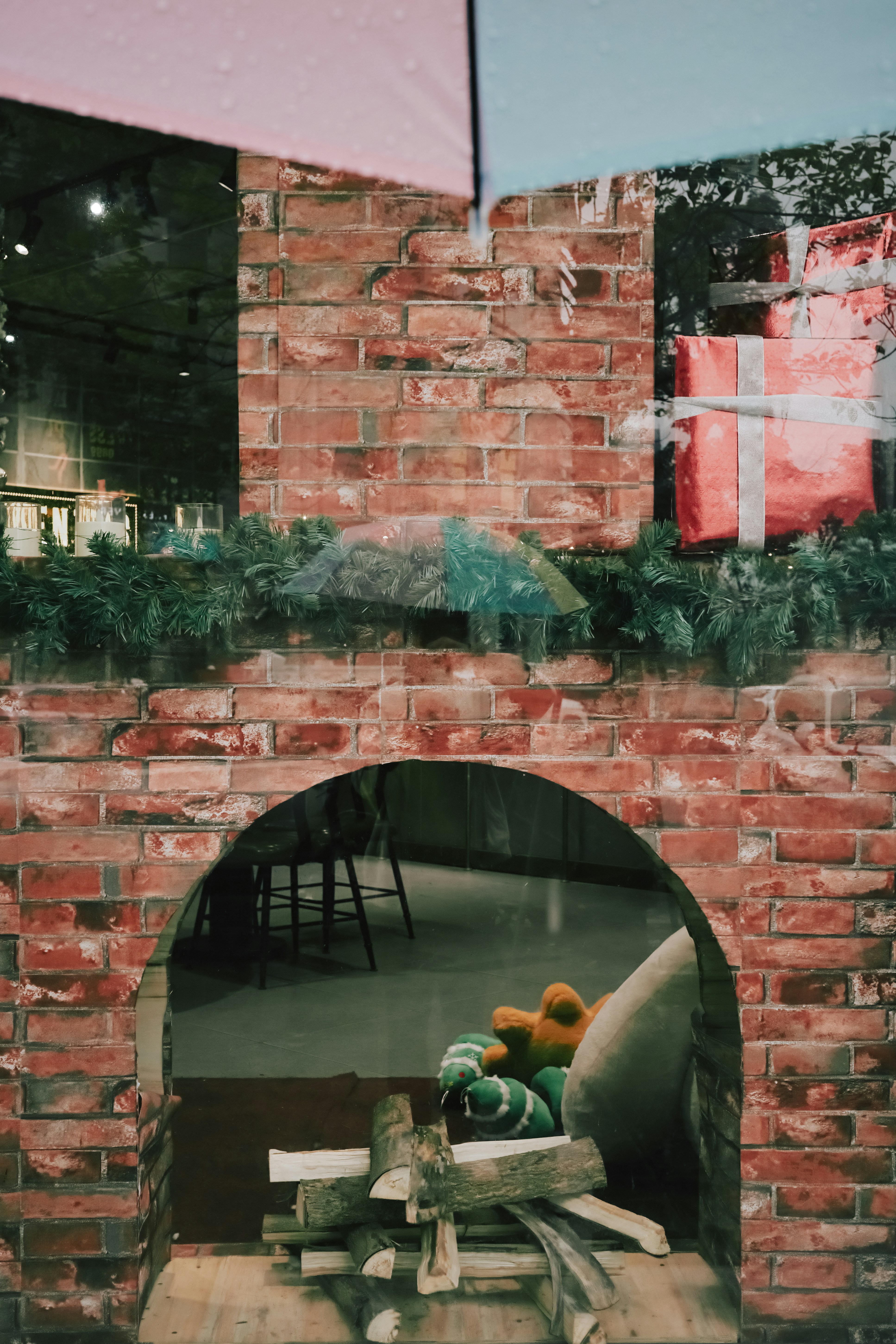 Brick Archway Hearth: Logs and Plush in a Cozy Display