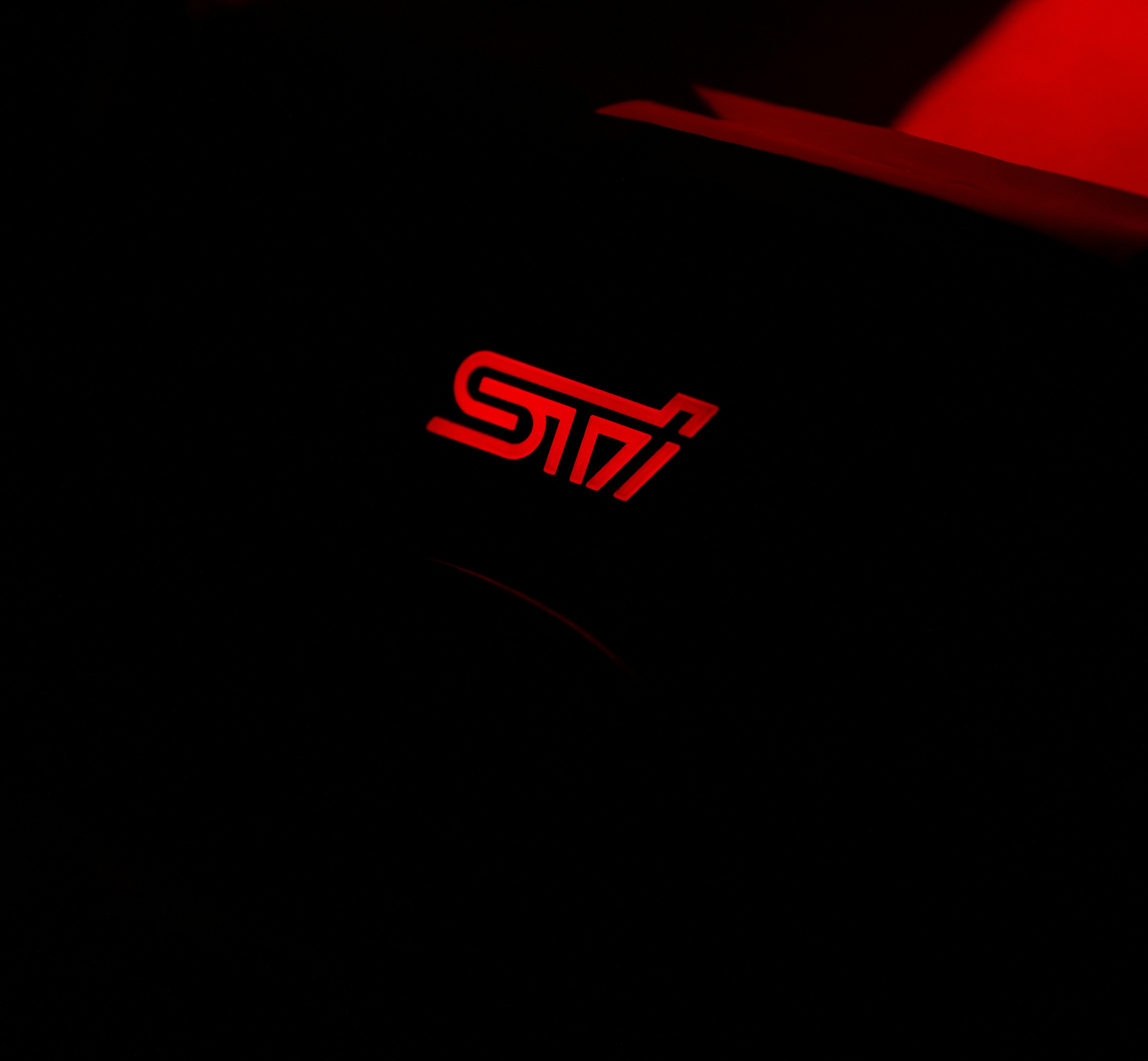 Red sti logo on black background photo – Free Cars Image on Unsplash
