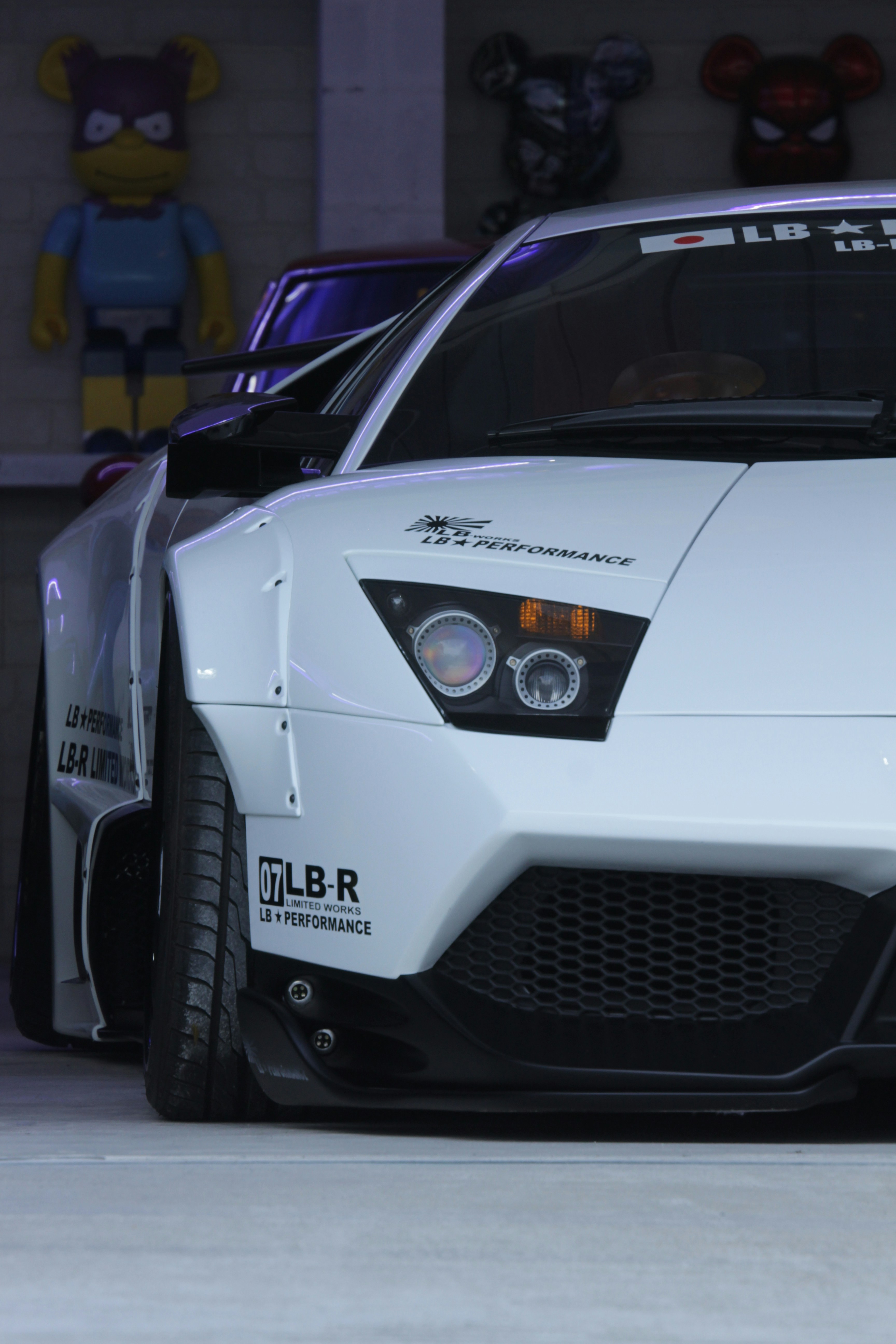 Lamborghini Stance: A White Powerhouse Under Showroom Neon