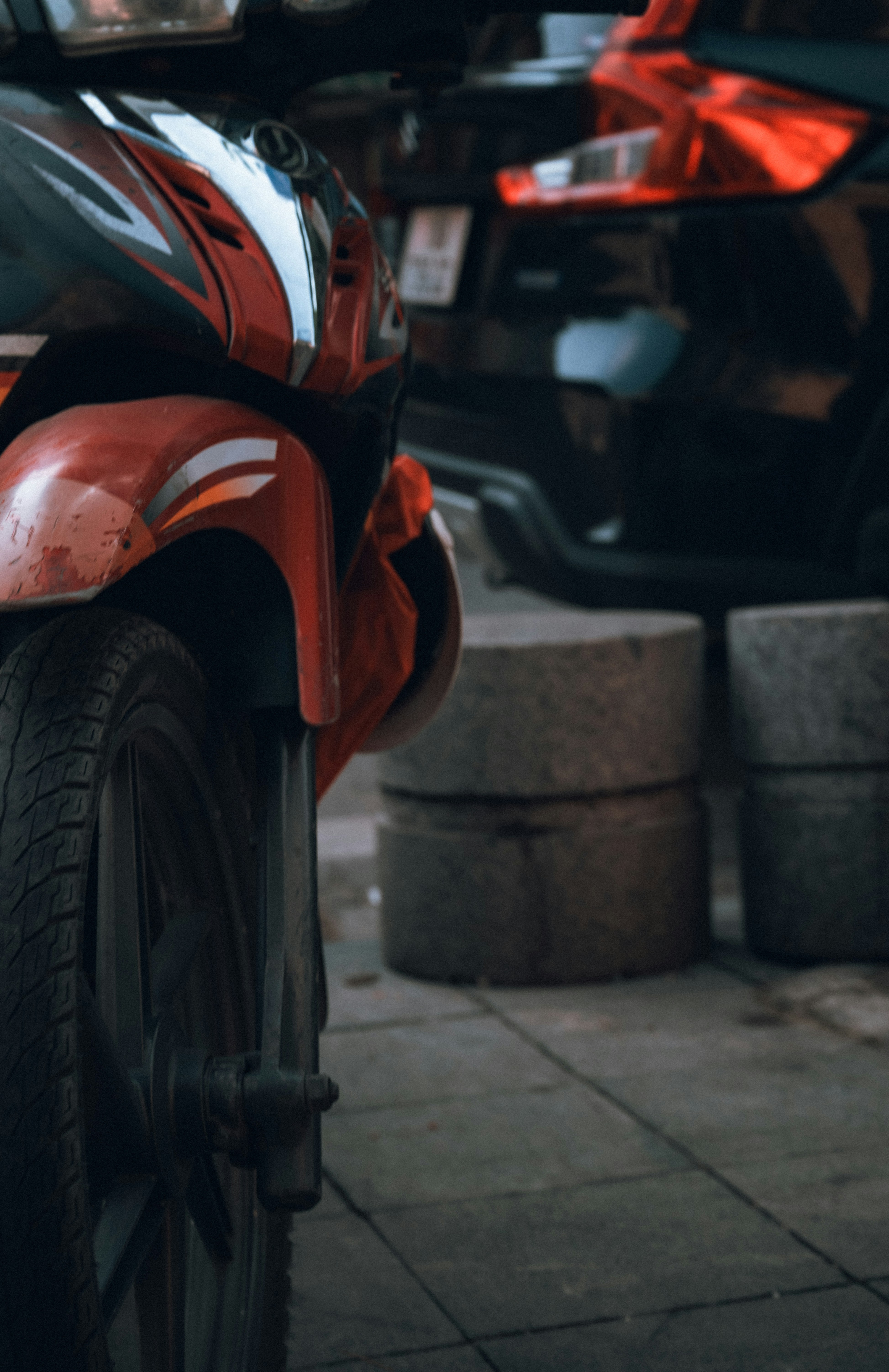 Red Urban Moto at Dusk: A Close-Up of Parking Geometry