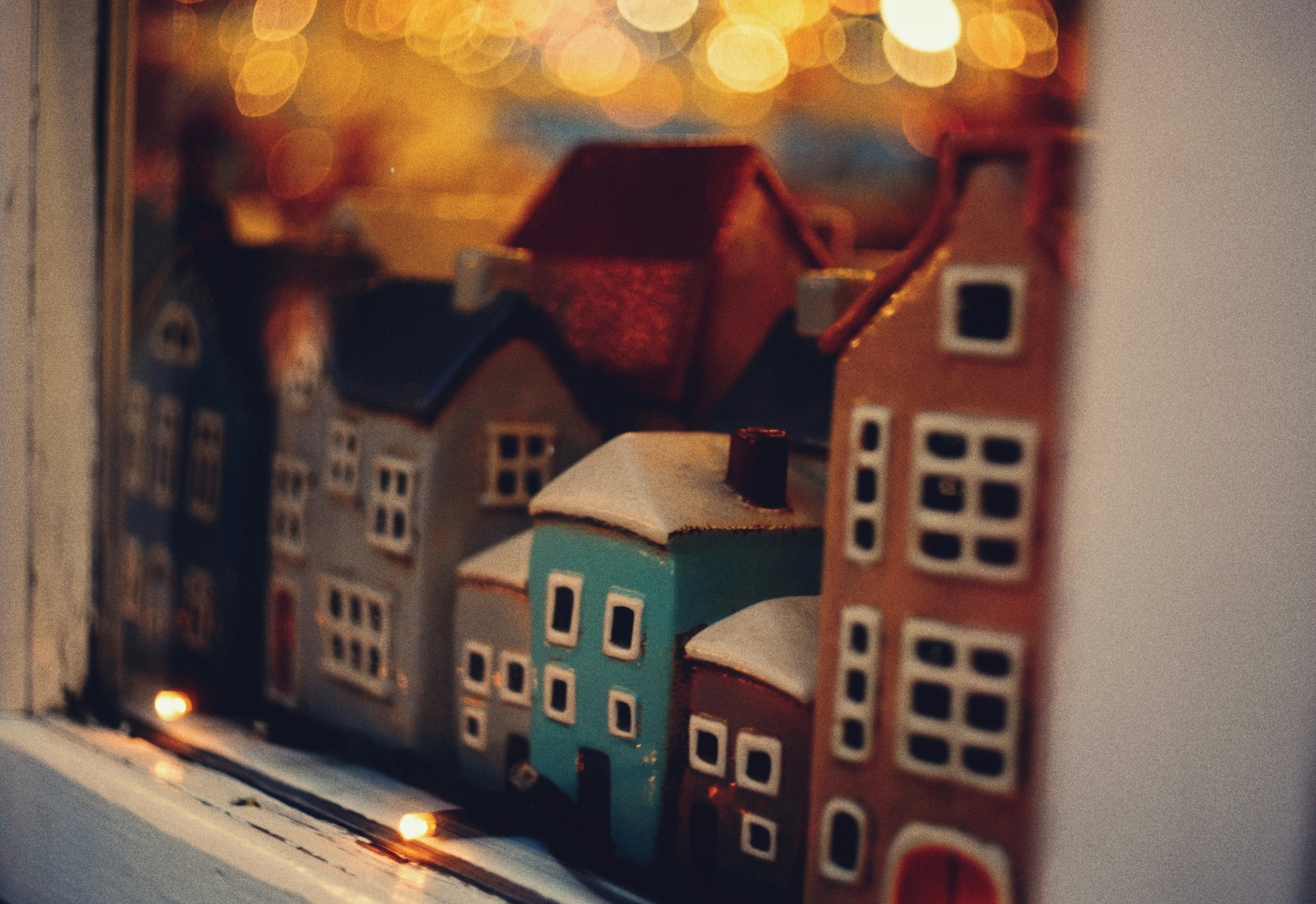 Miniature City Street Lit by Quiet Windows