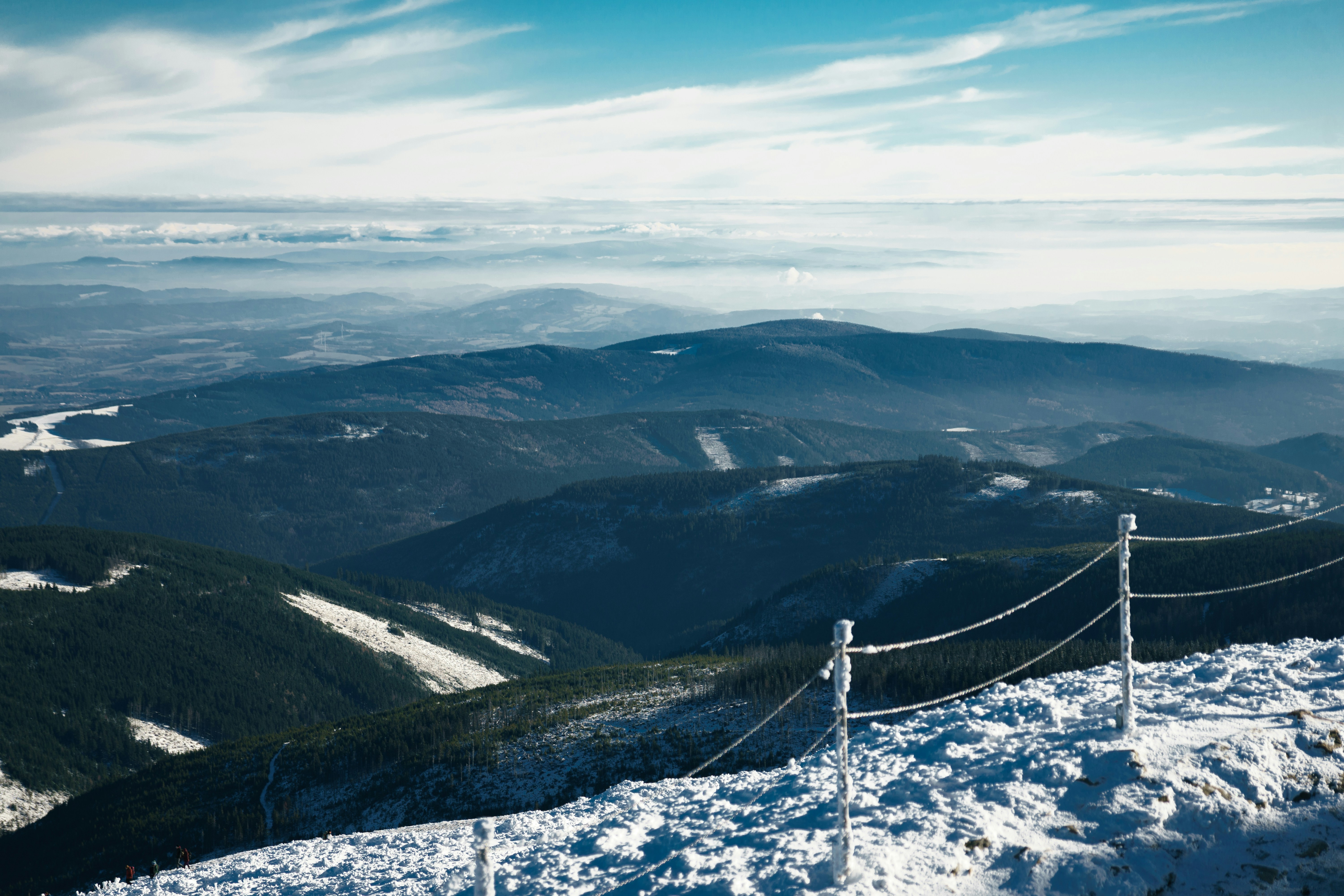 Snowbound Summit Railings Against a Distant Valley