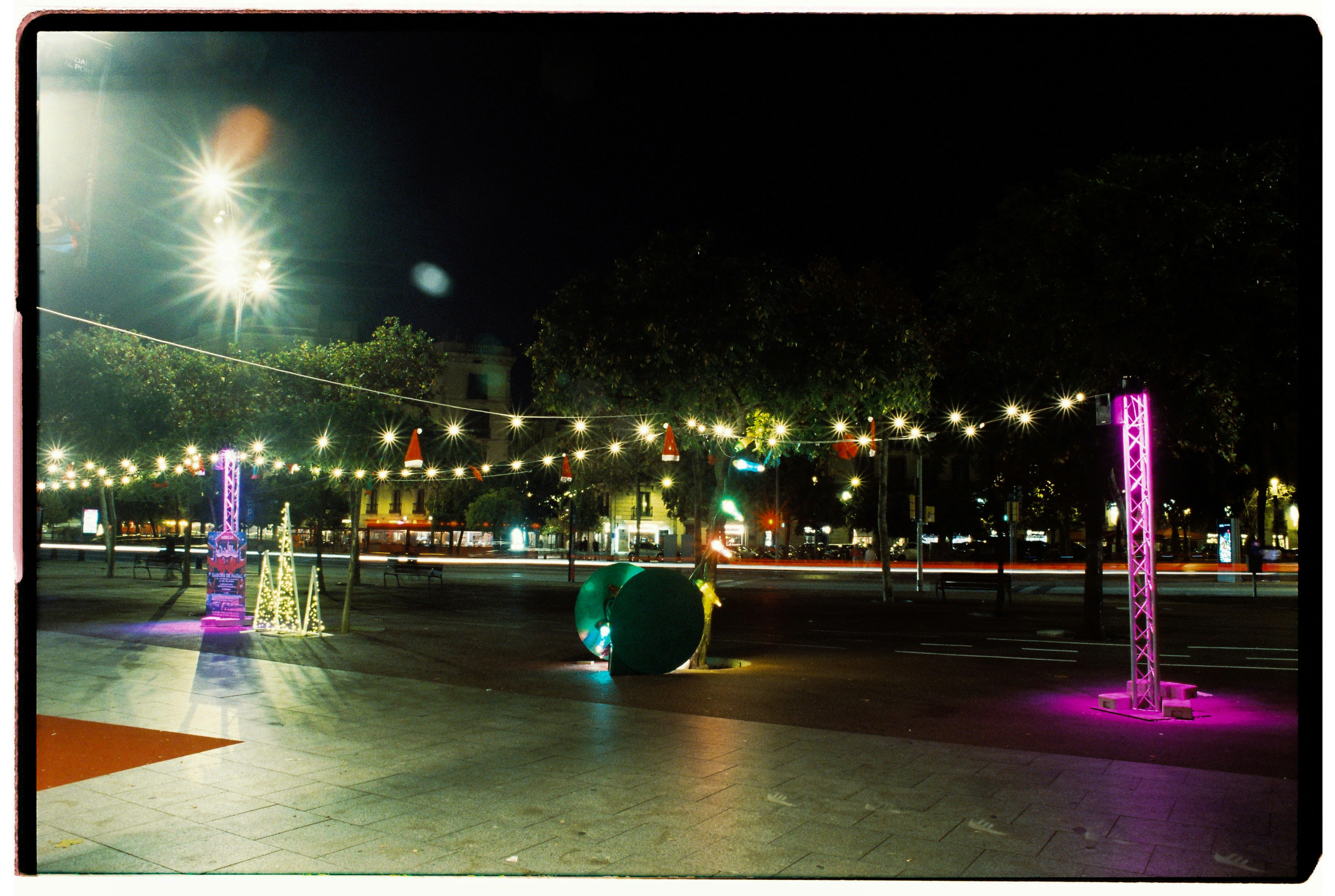 Night Lights in the Plaza: Stringed Glow Over a Quiet Circle