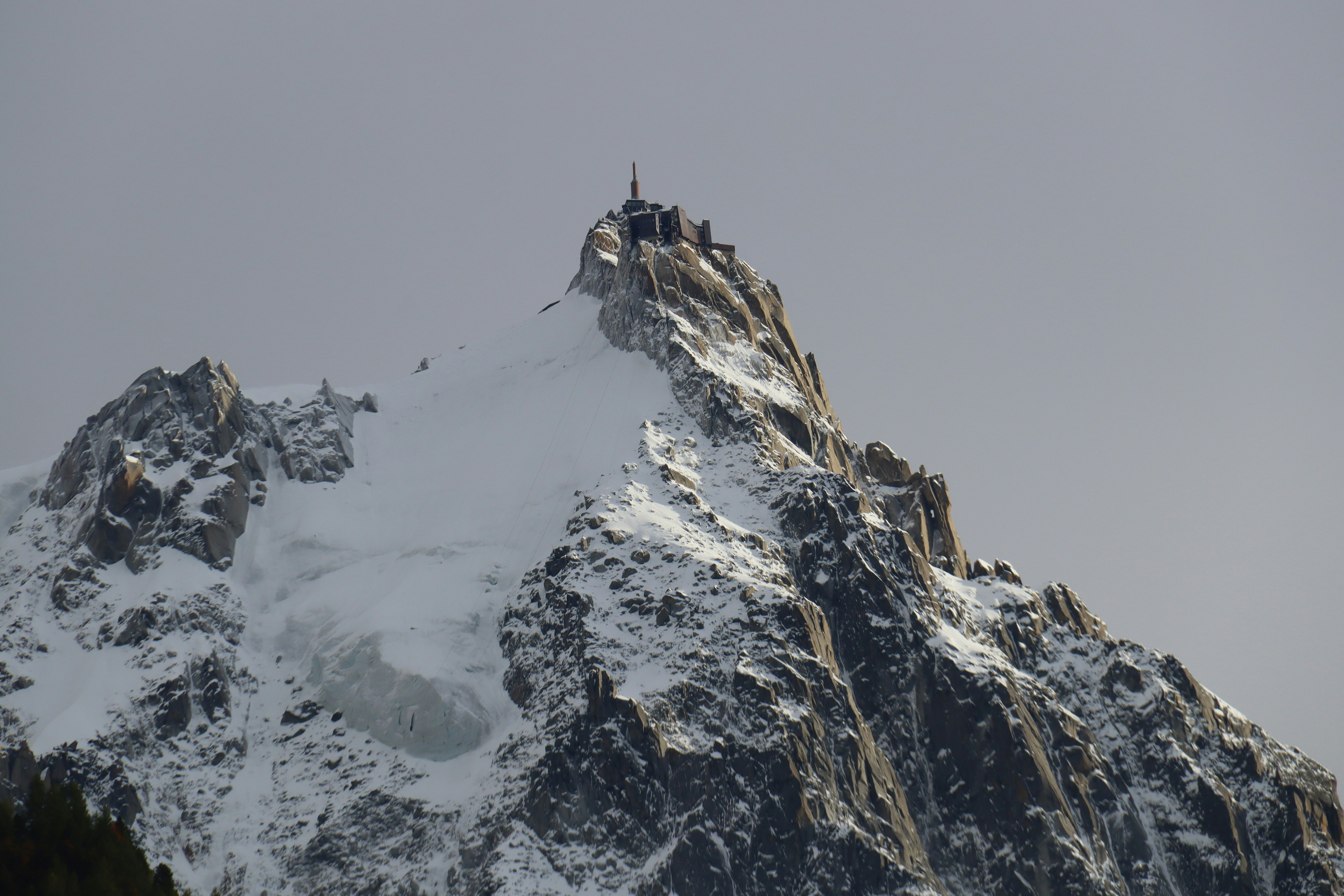 Snow‑Crowned Summit: A Rugged Peak Under Clear Skies