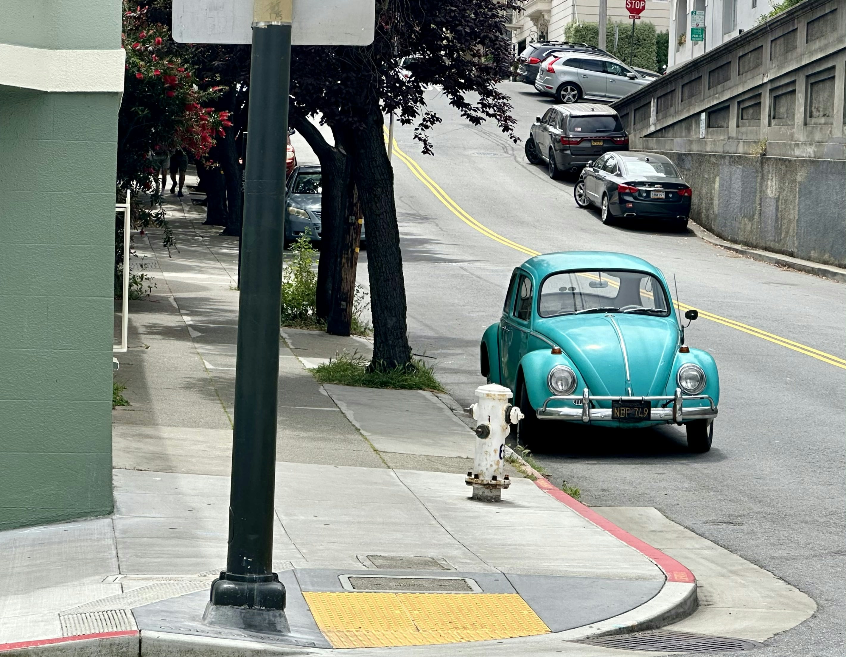 Turquoise Beetle on a Curved San Francisco Street