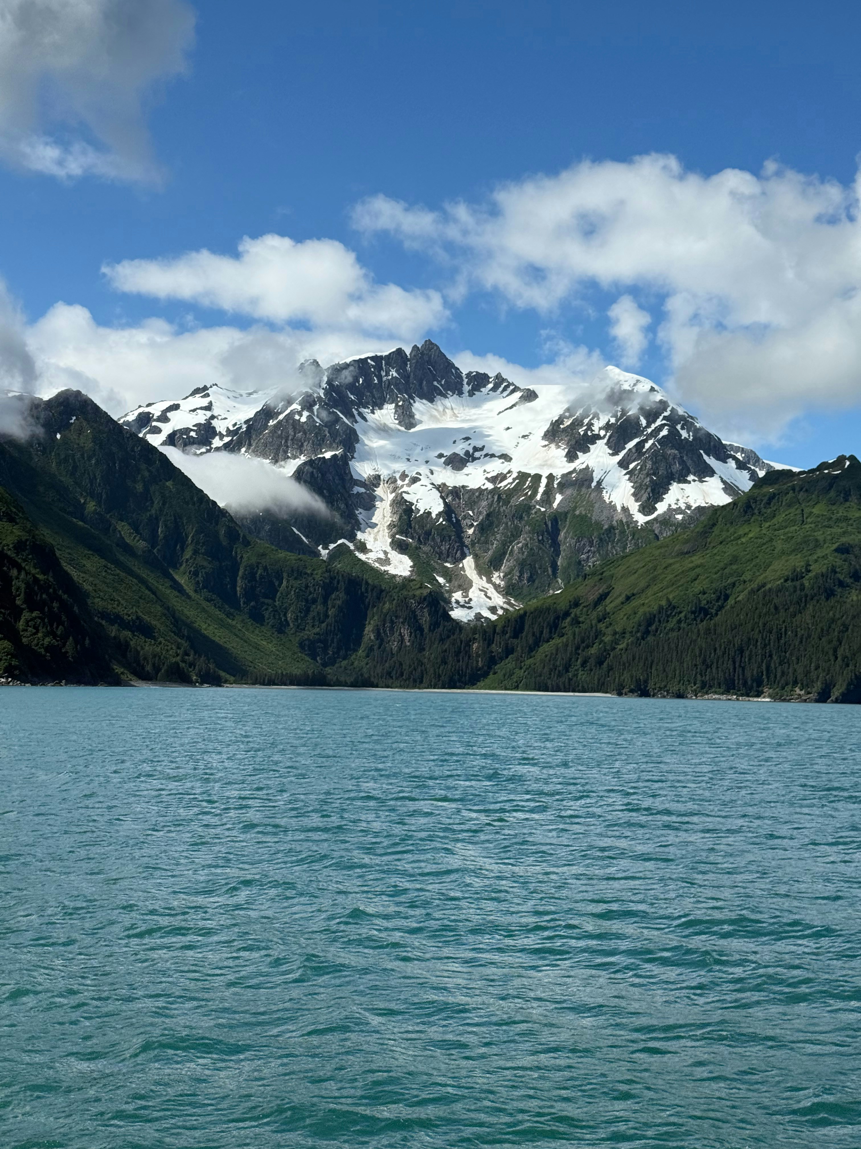 Glacial Peaks Over A Turquoise Lake