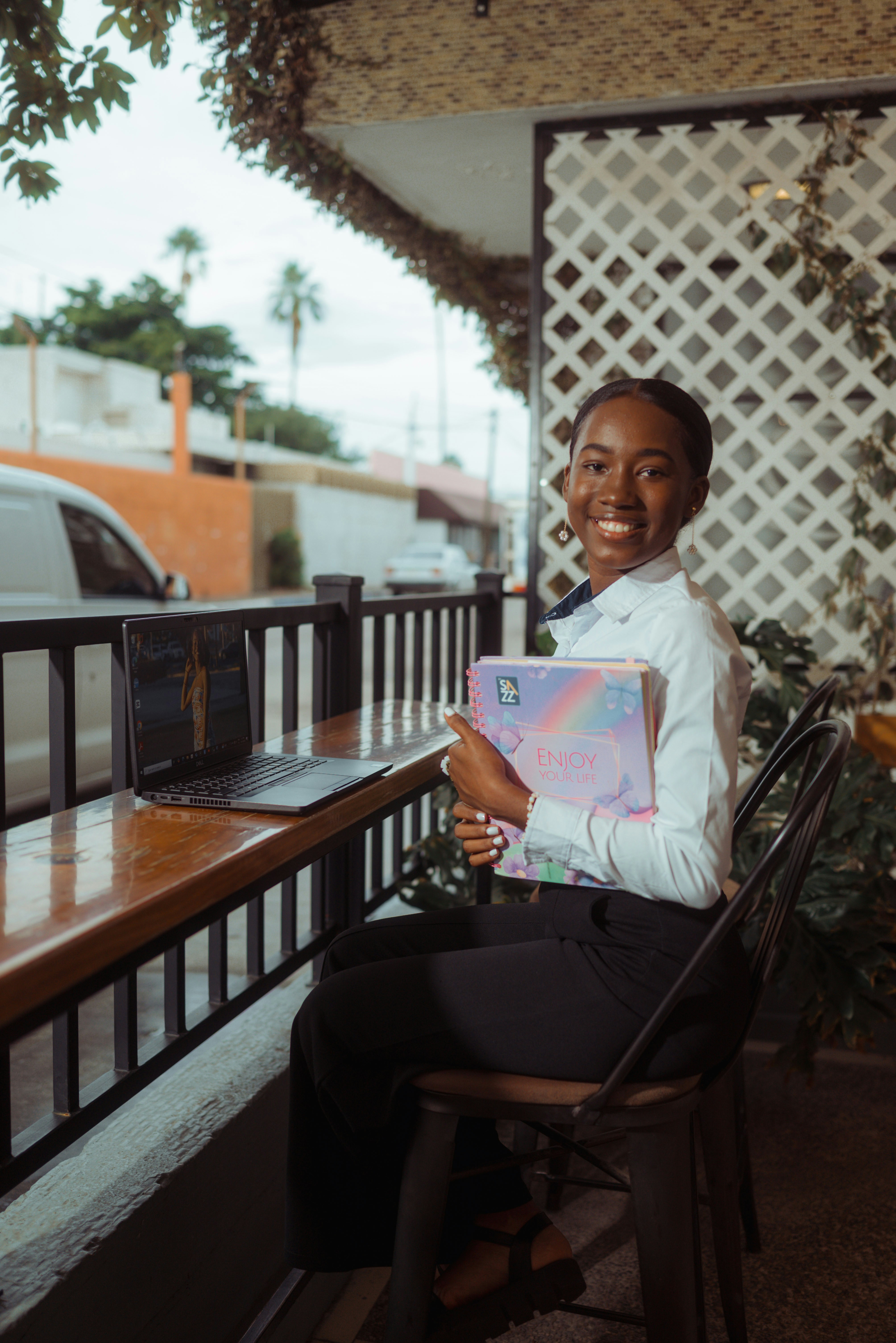 Smiling Professional at a Woodland-Accent Café Window