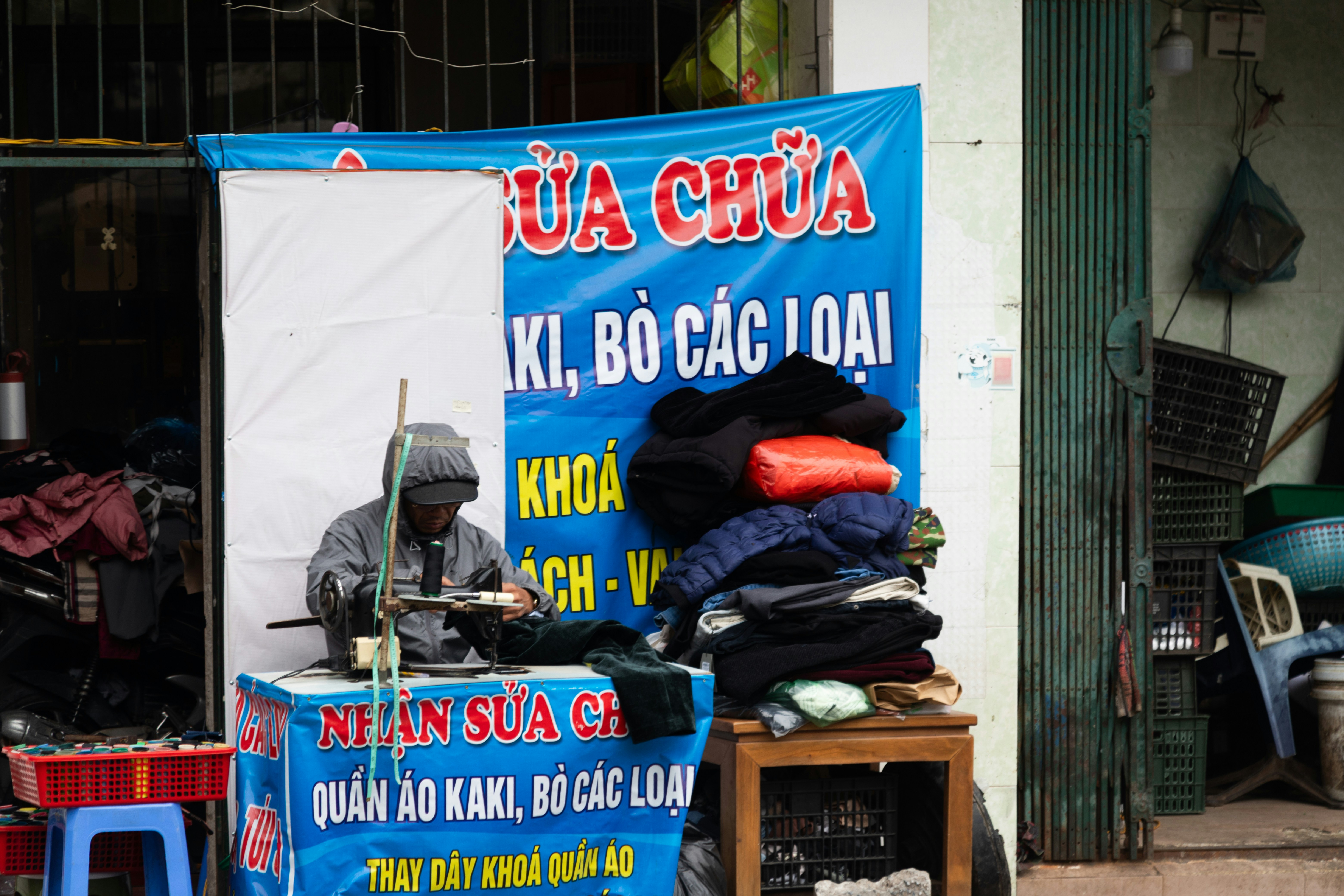 Stall of Fabric and Signage in Front of a Shop